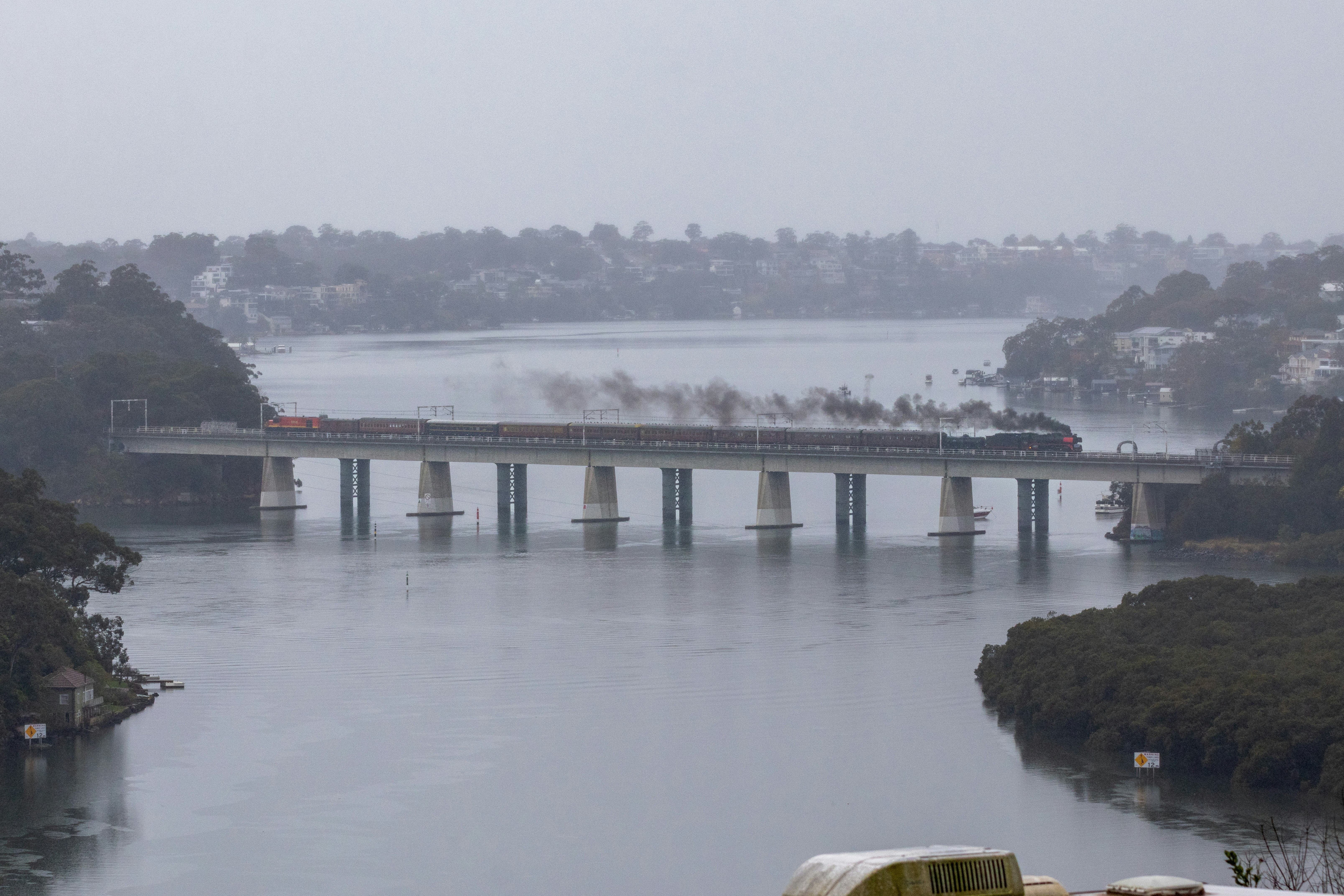Bridge Over Quiet Waters: A Misty Coastal Corridor
