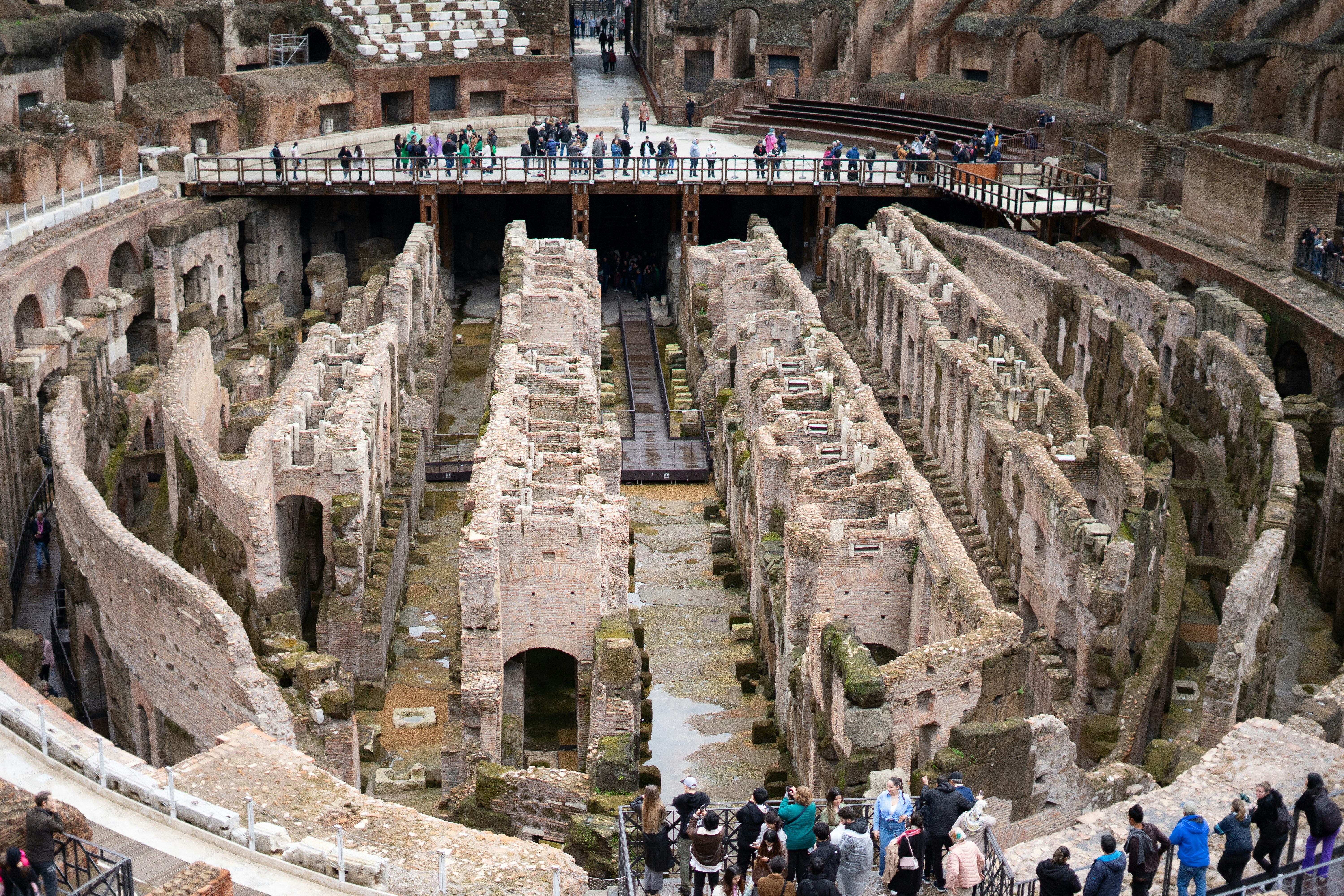 Echoes of Stone: Tourists Above the Ancient Arena