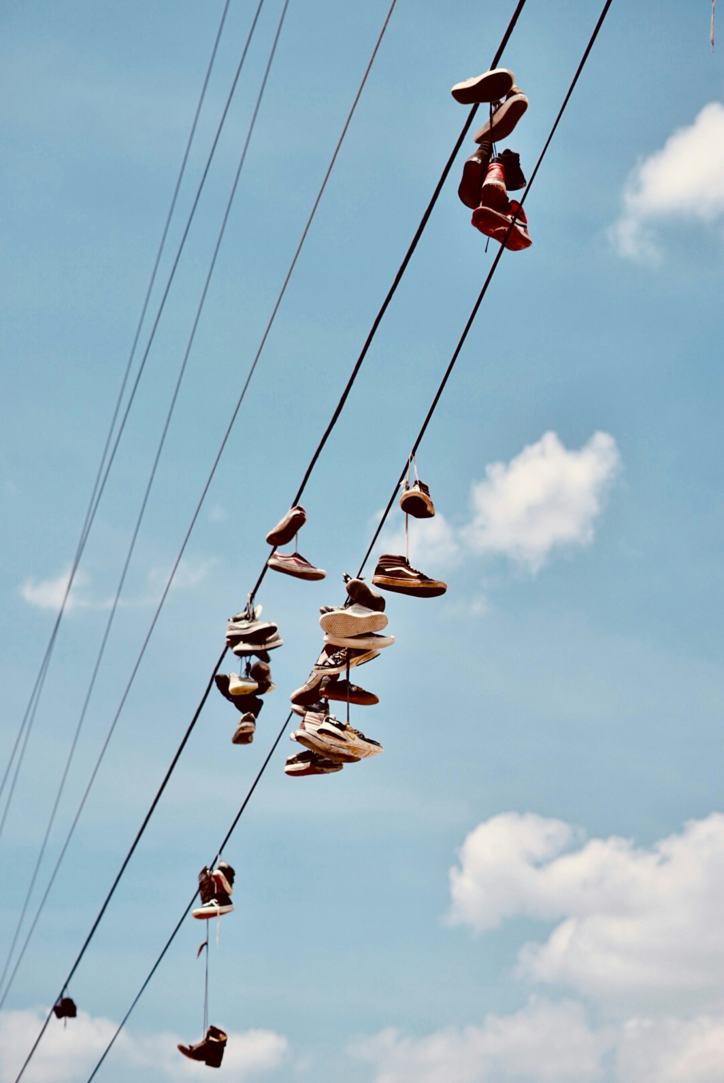 Shoes on a Wire: A Skyward Climb of Forgotten Footwear