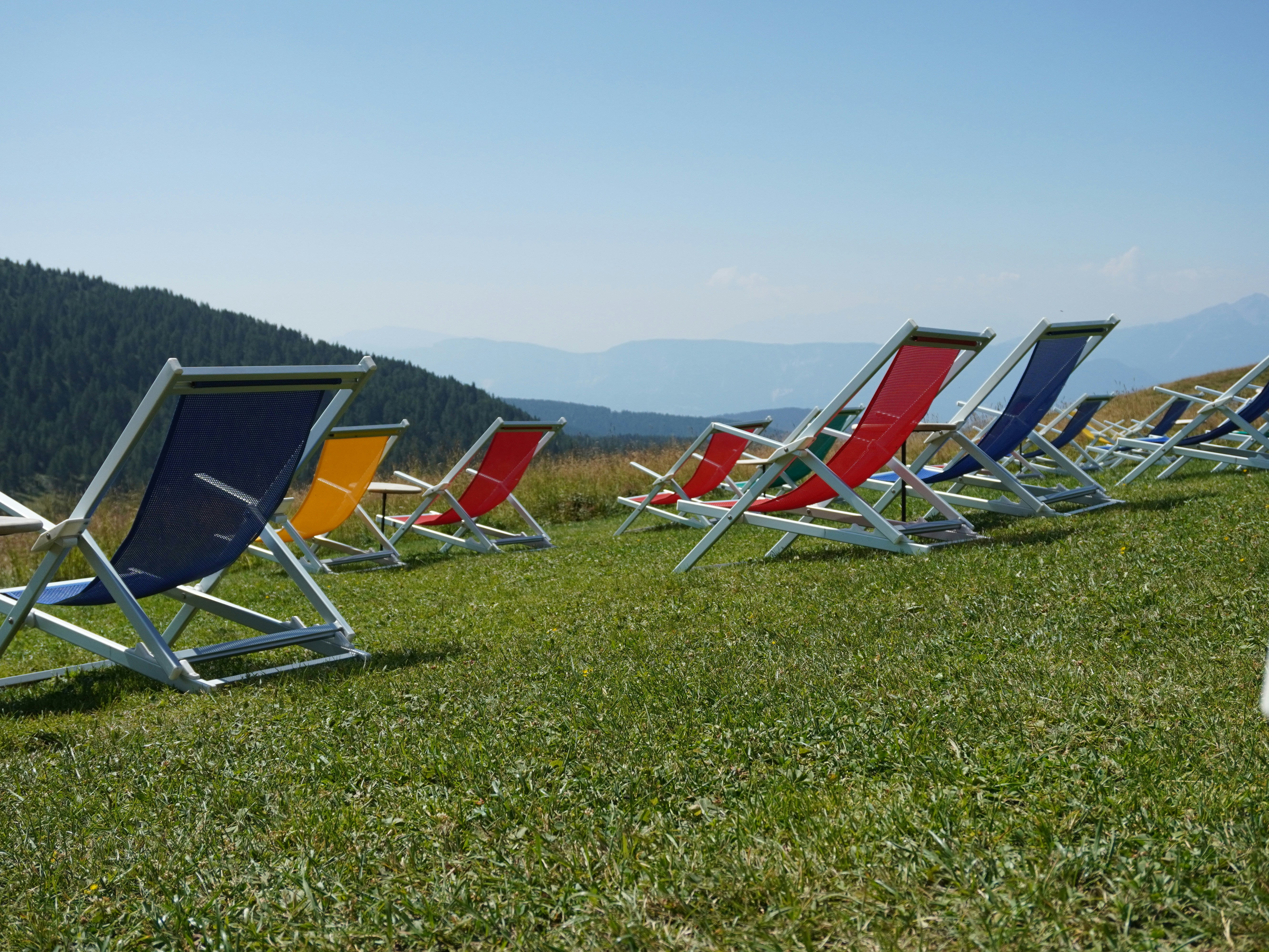 Row of Colorful Beach Loungers Reaching Toward a Distant Horizon
