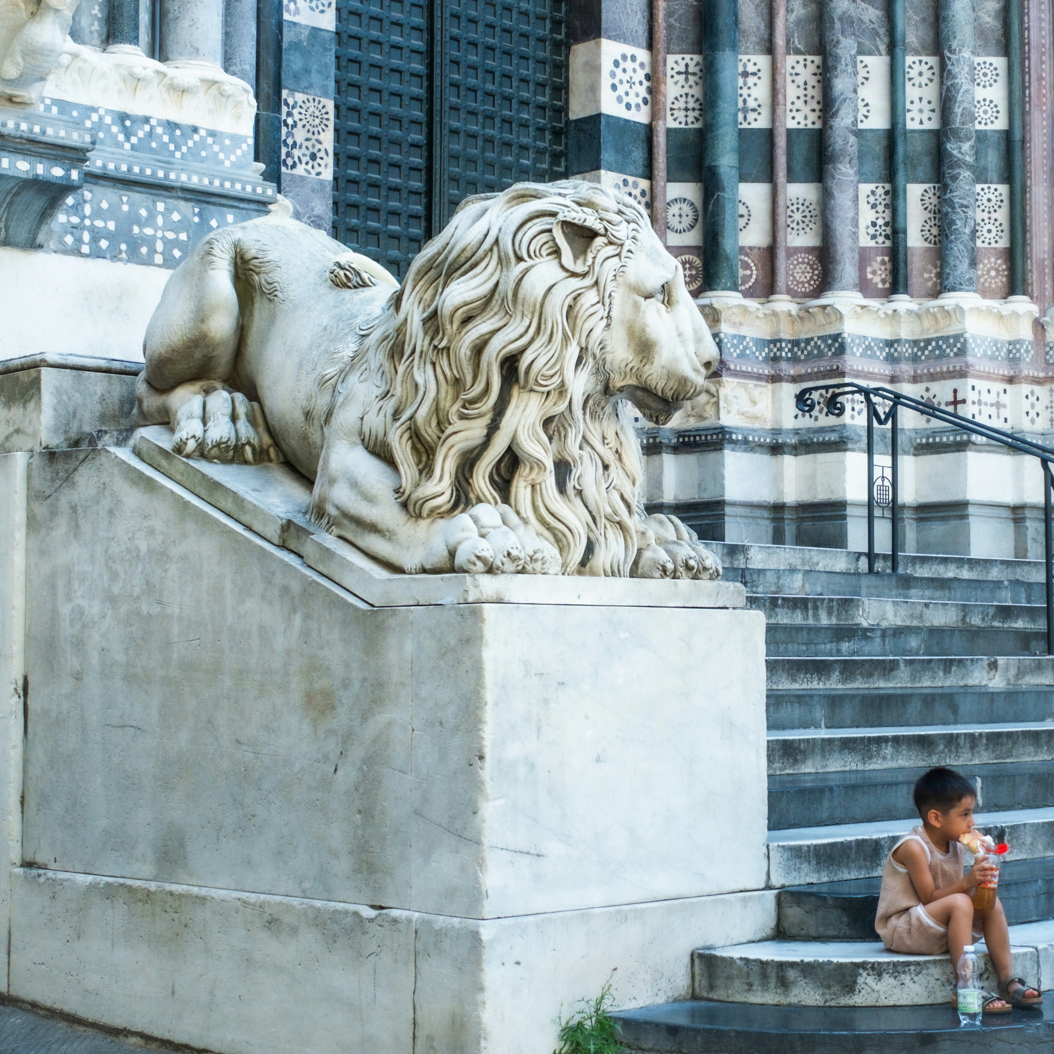 Lion's Gate: Child at the Steps Beside the Ornate Monument