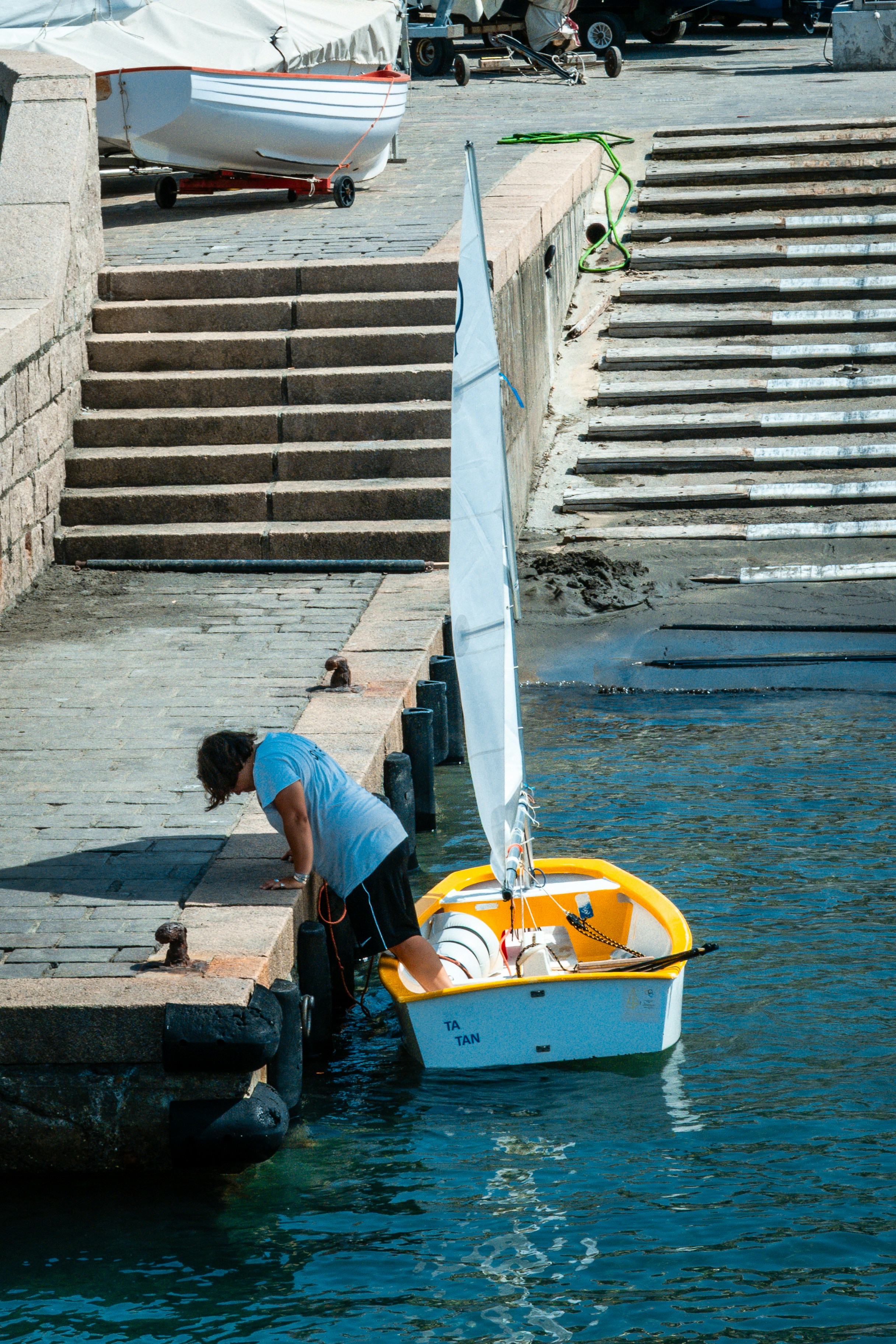 Harbor Youth at the Edge of the Sailboat