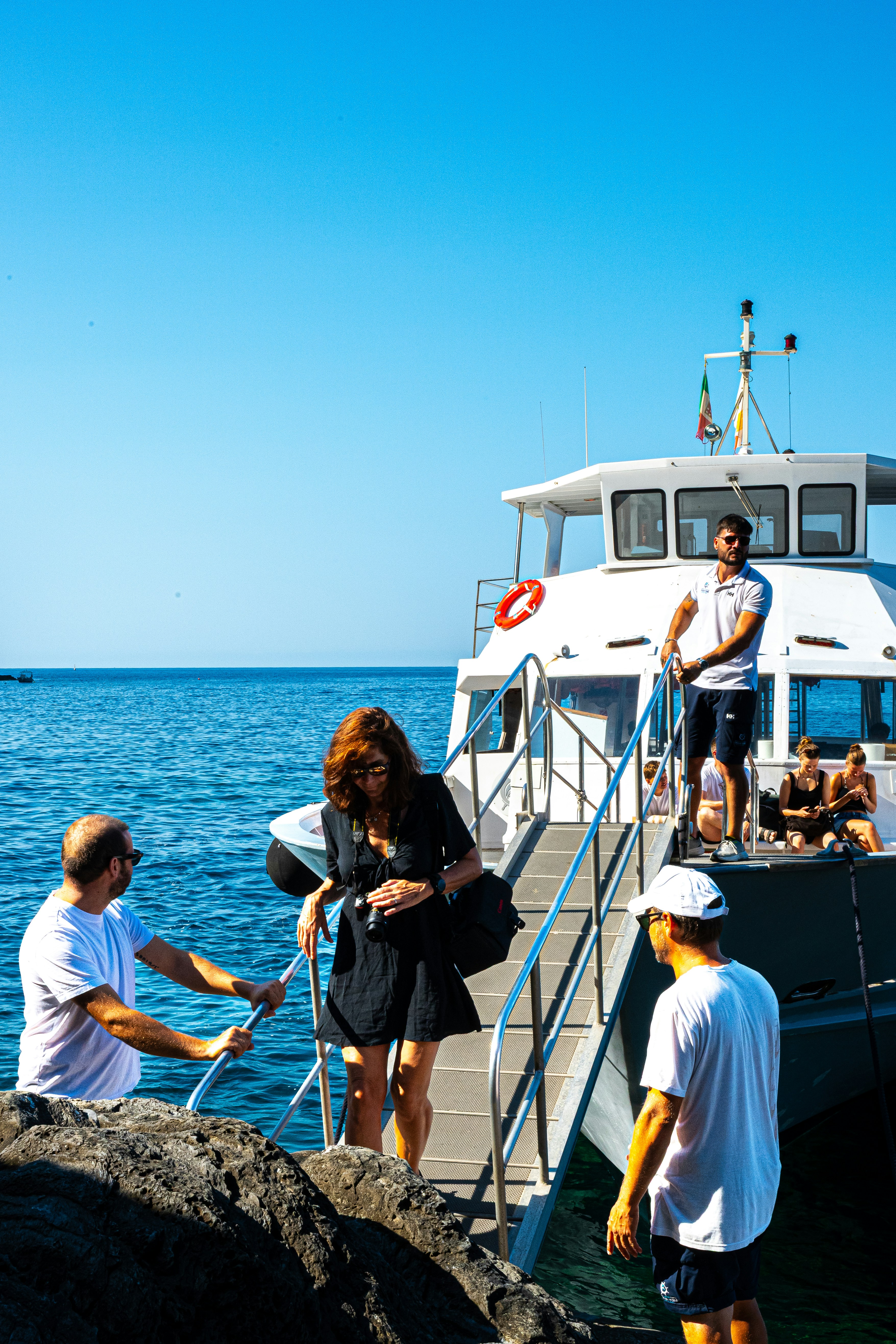Dockside Encounter: The Group Converges on the Vessel