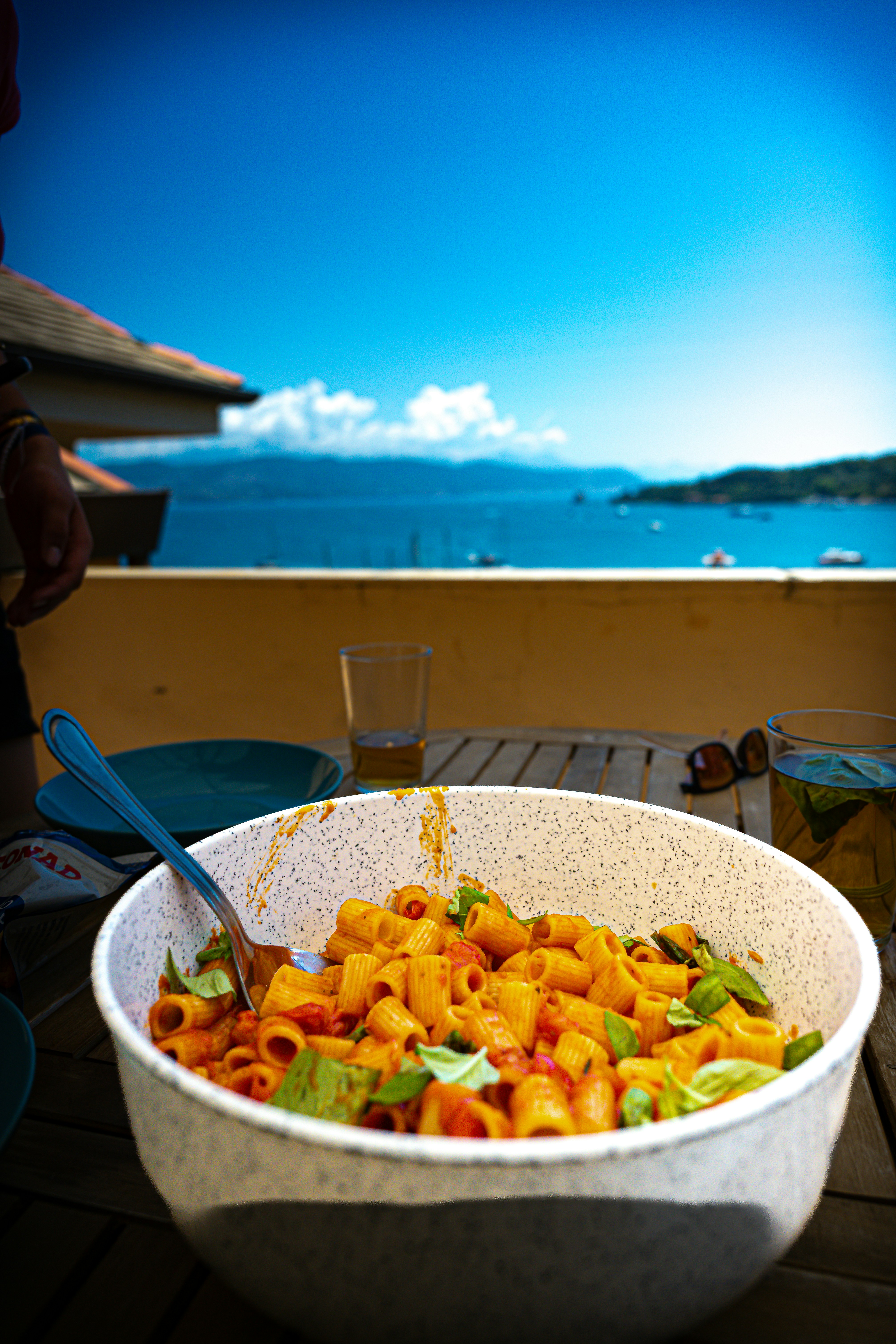 Sunlit Pasta Still Life on a Seaside Terrace