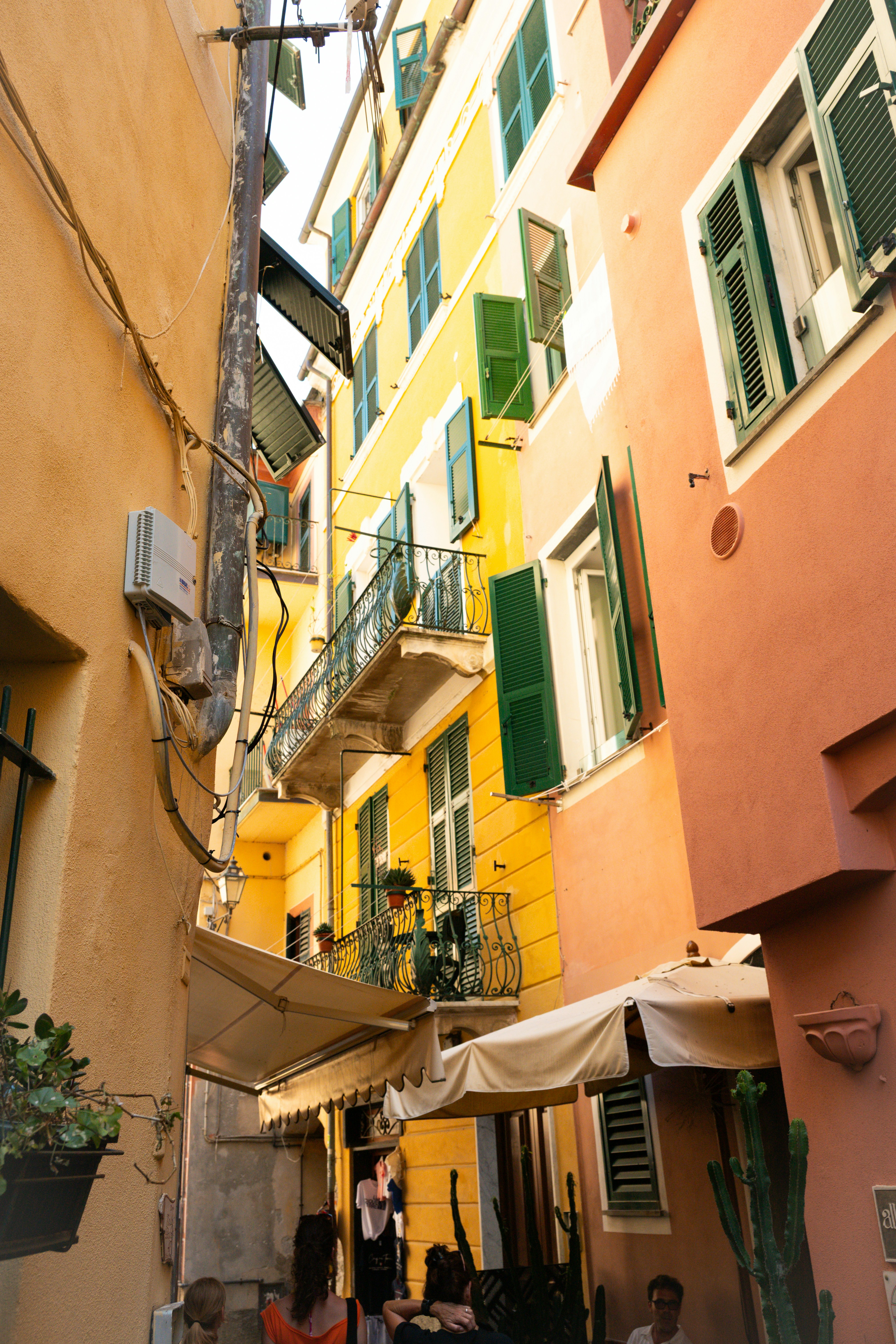 Sunlit Alley of Colorful Flats