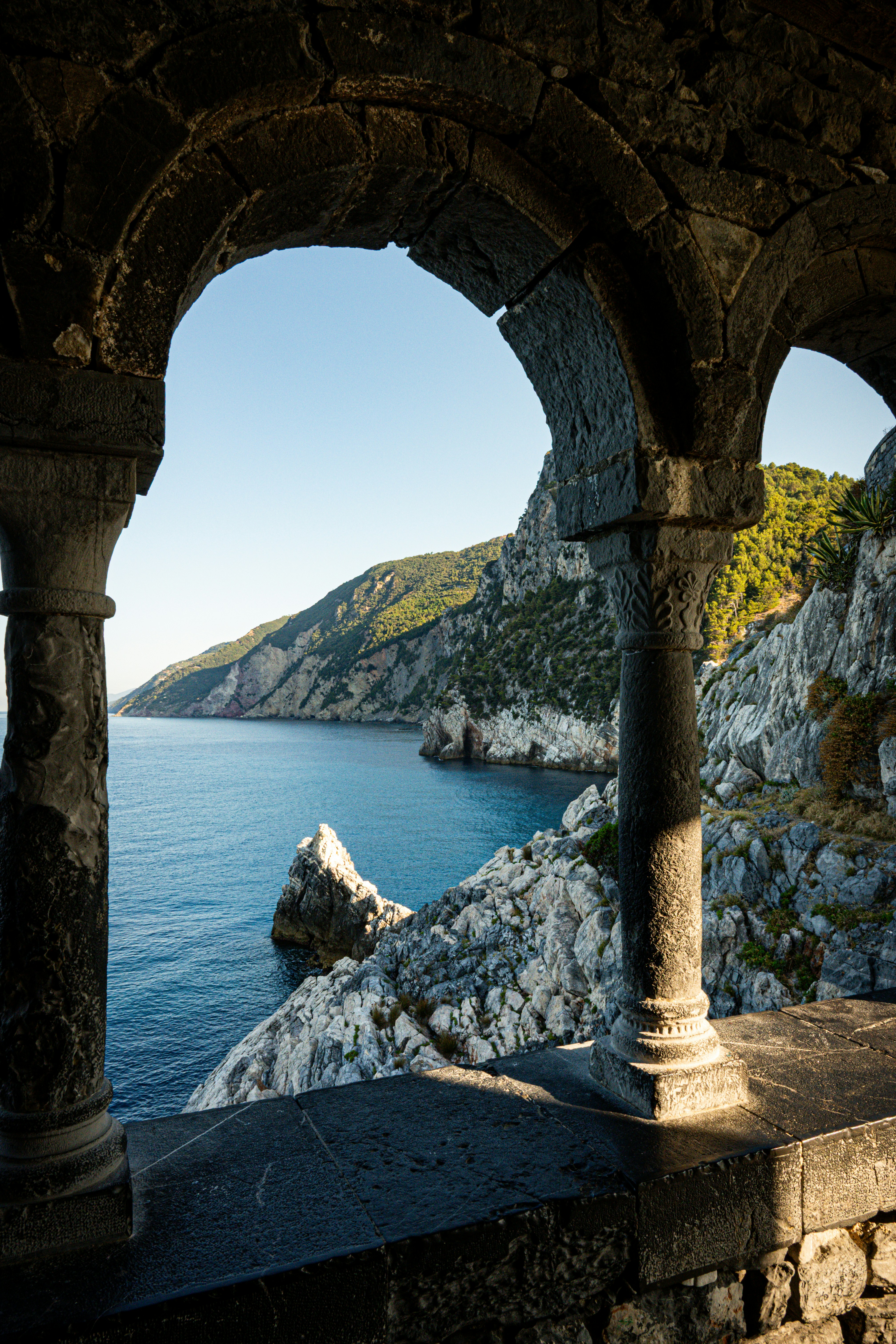 Seaward Archway: Stone Columns Framing a Cliffside Vista