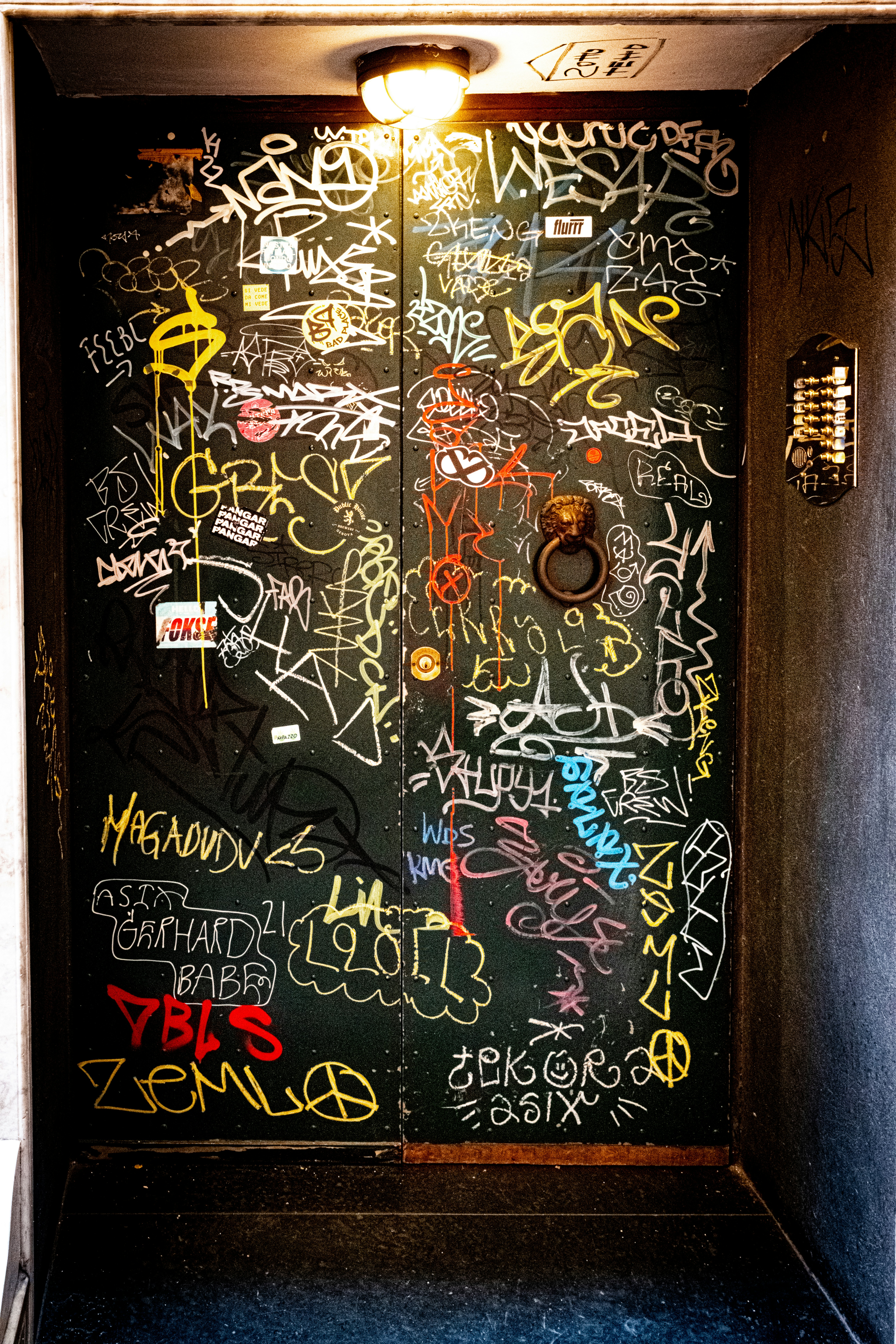 Graffiti Corridor: Graffitied Doors in a Neon-Soft Halo