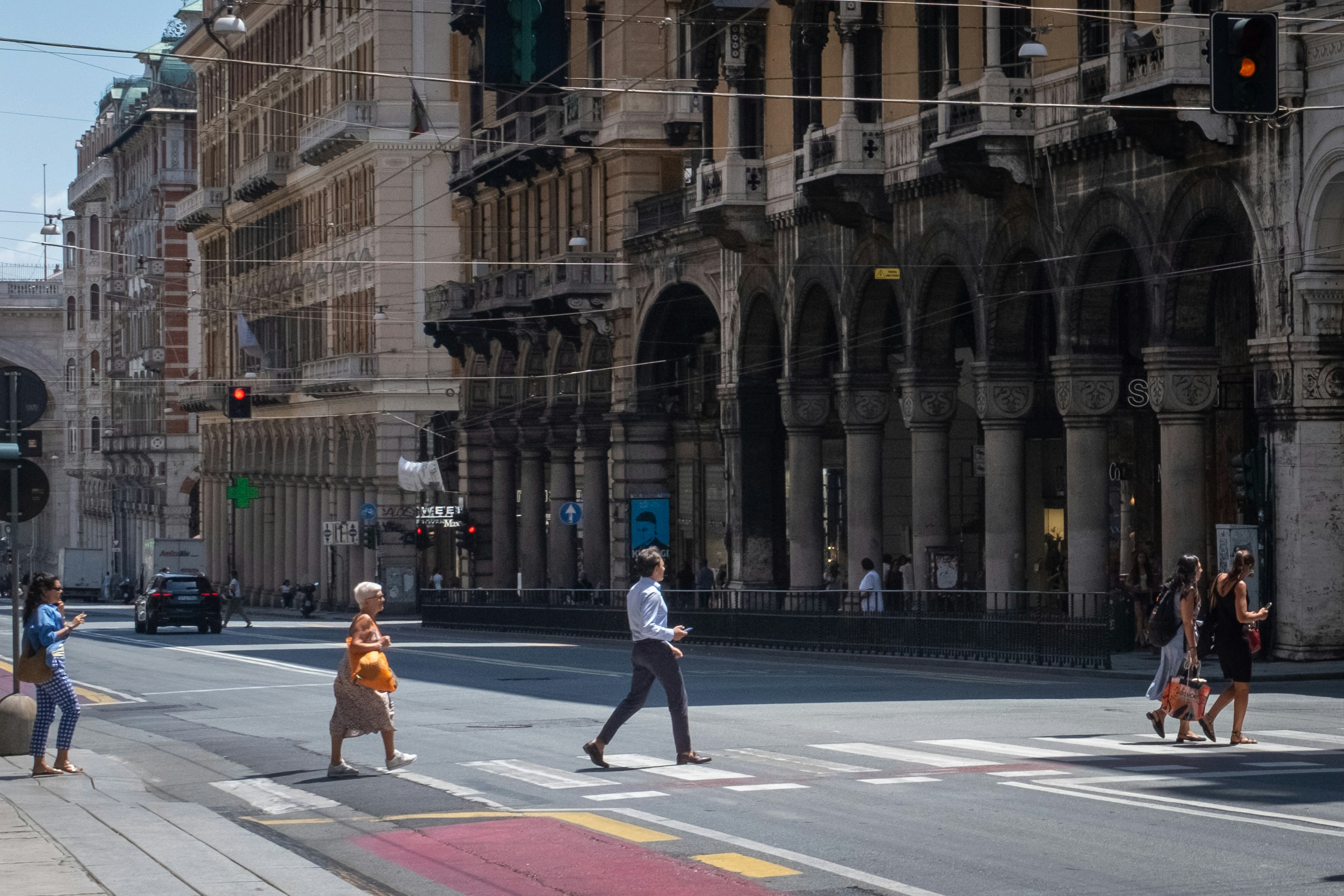 Crosswalk Moment Across a Historic Arcade