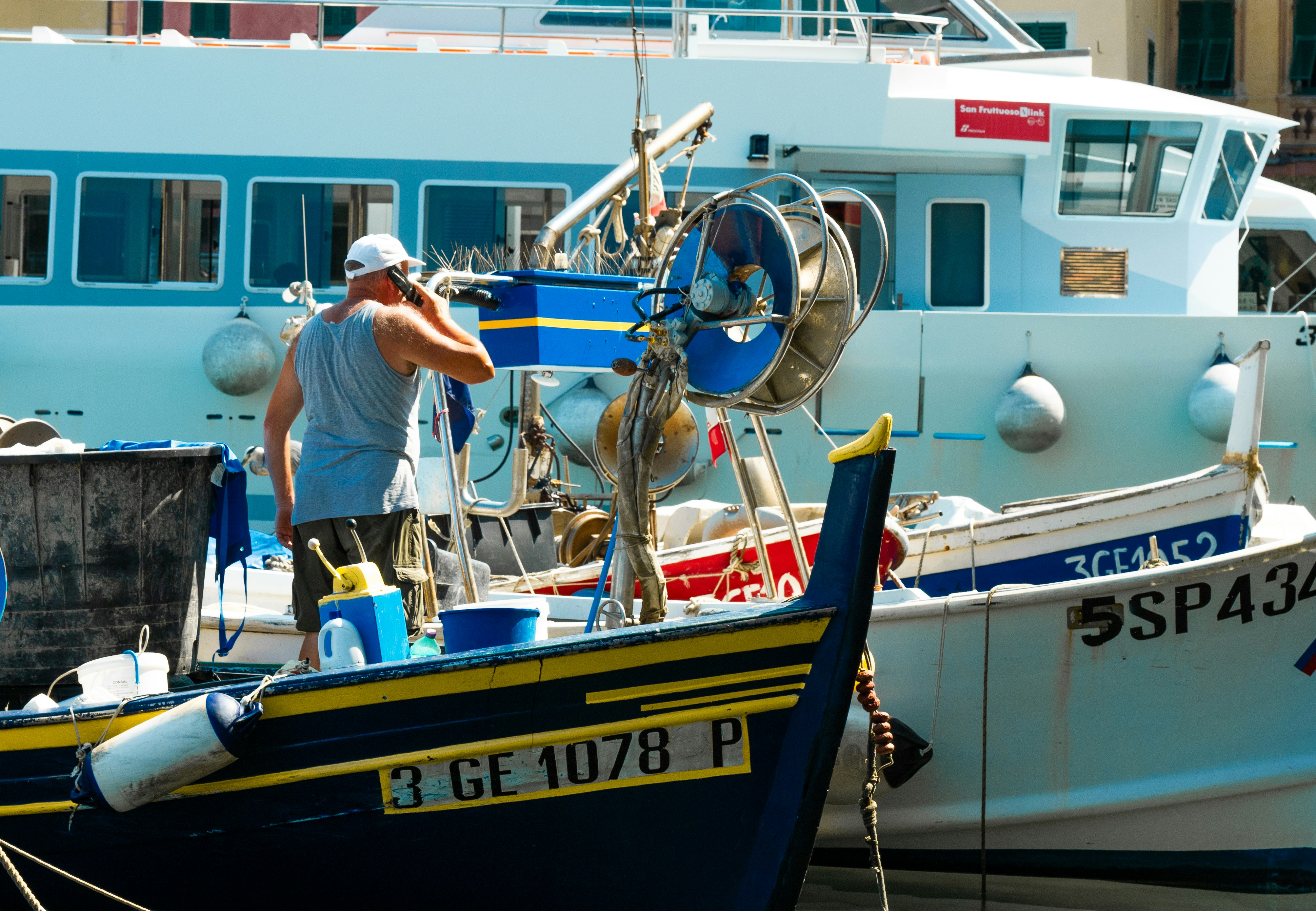 Dockside Crewman at Work: A Tide of Details and Machinery