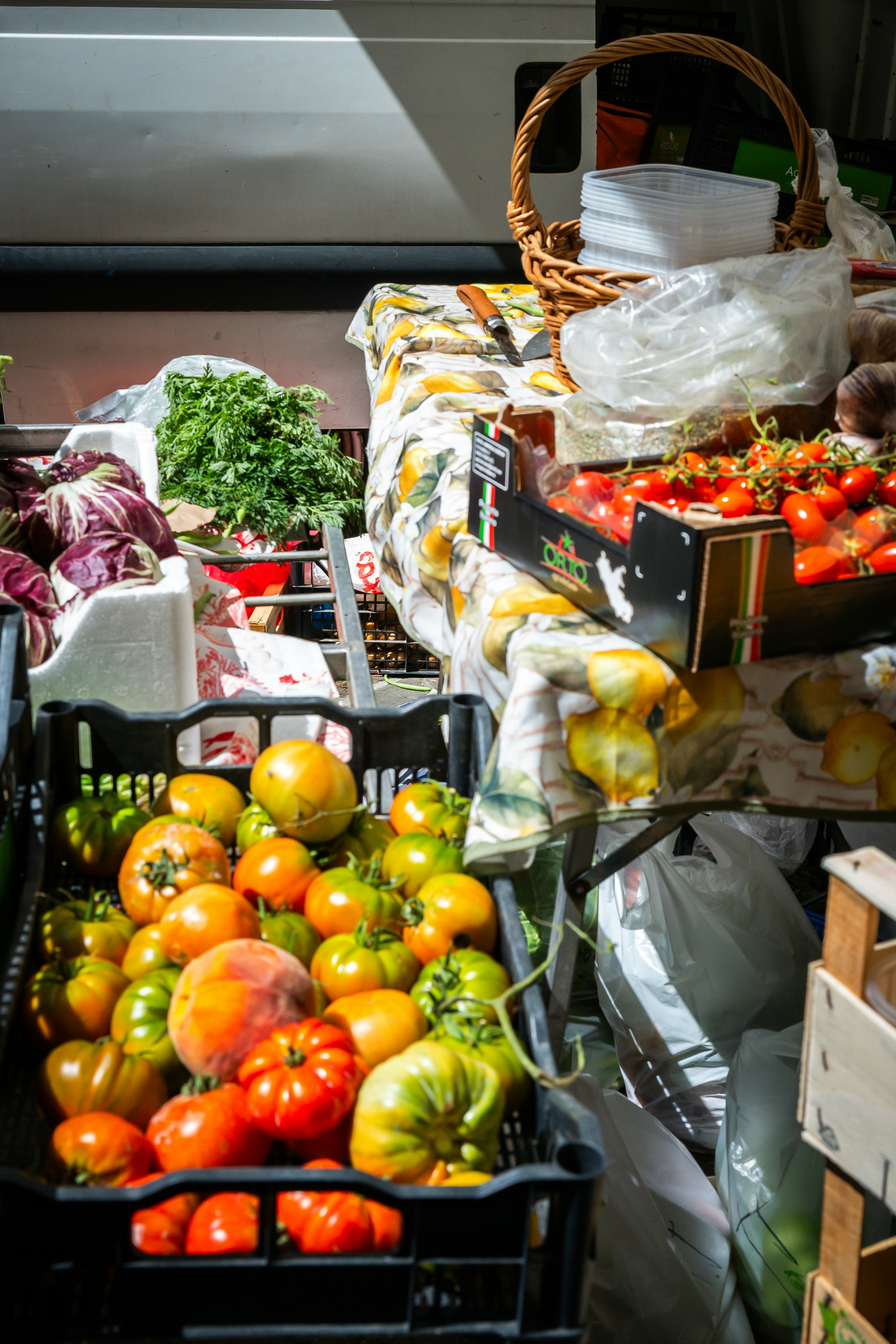 Vibrant Tomato Stall Bathed in Outdoor Market Light
