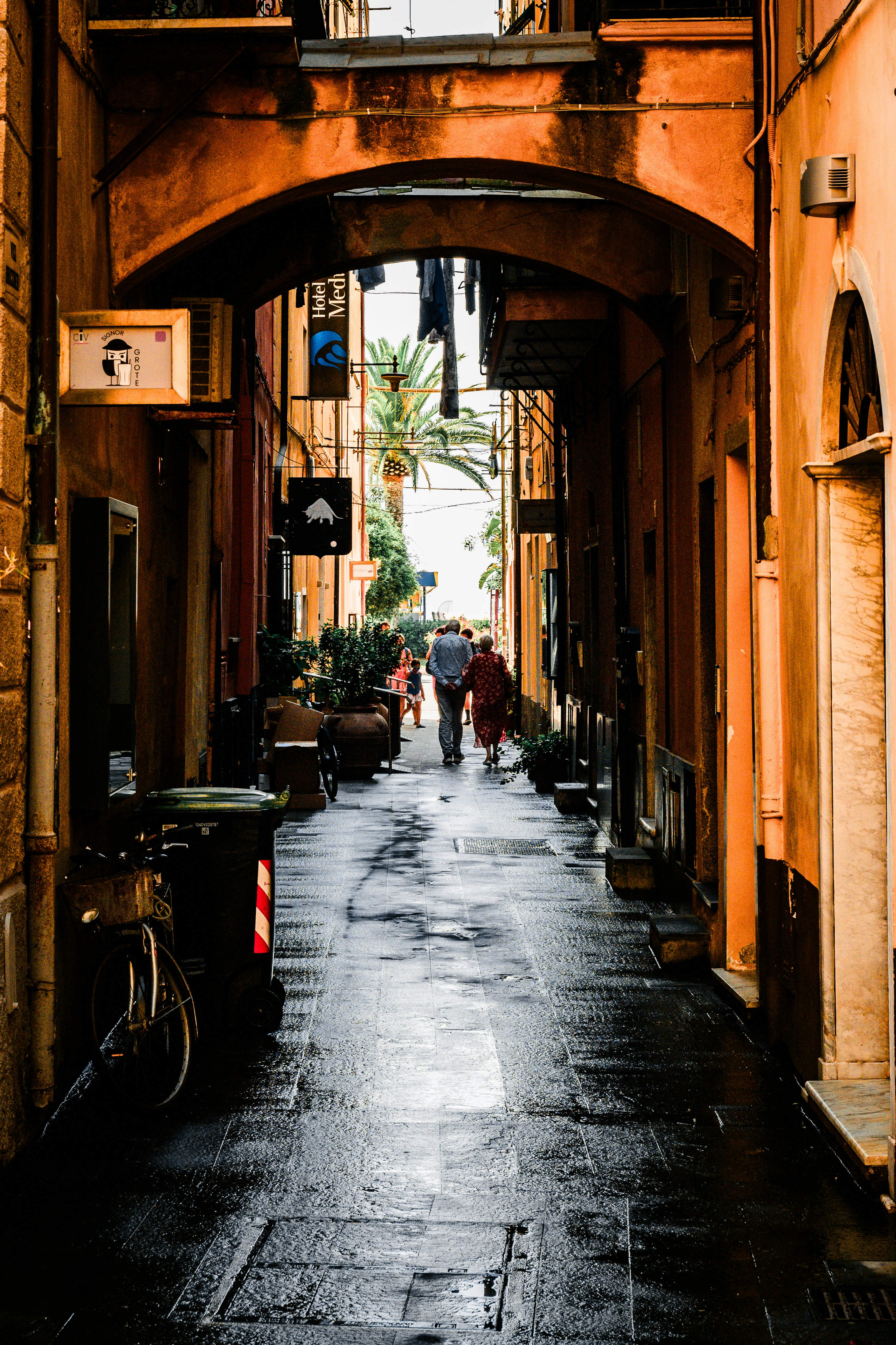 Sunlit Archway into a Quiet Mediterranean Alley