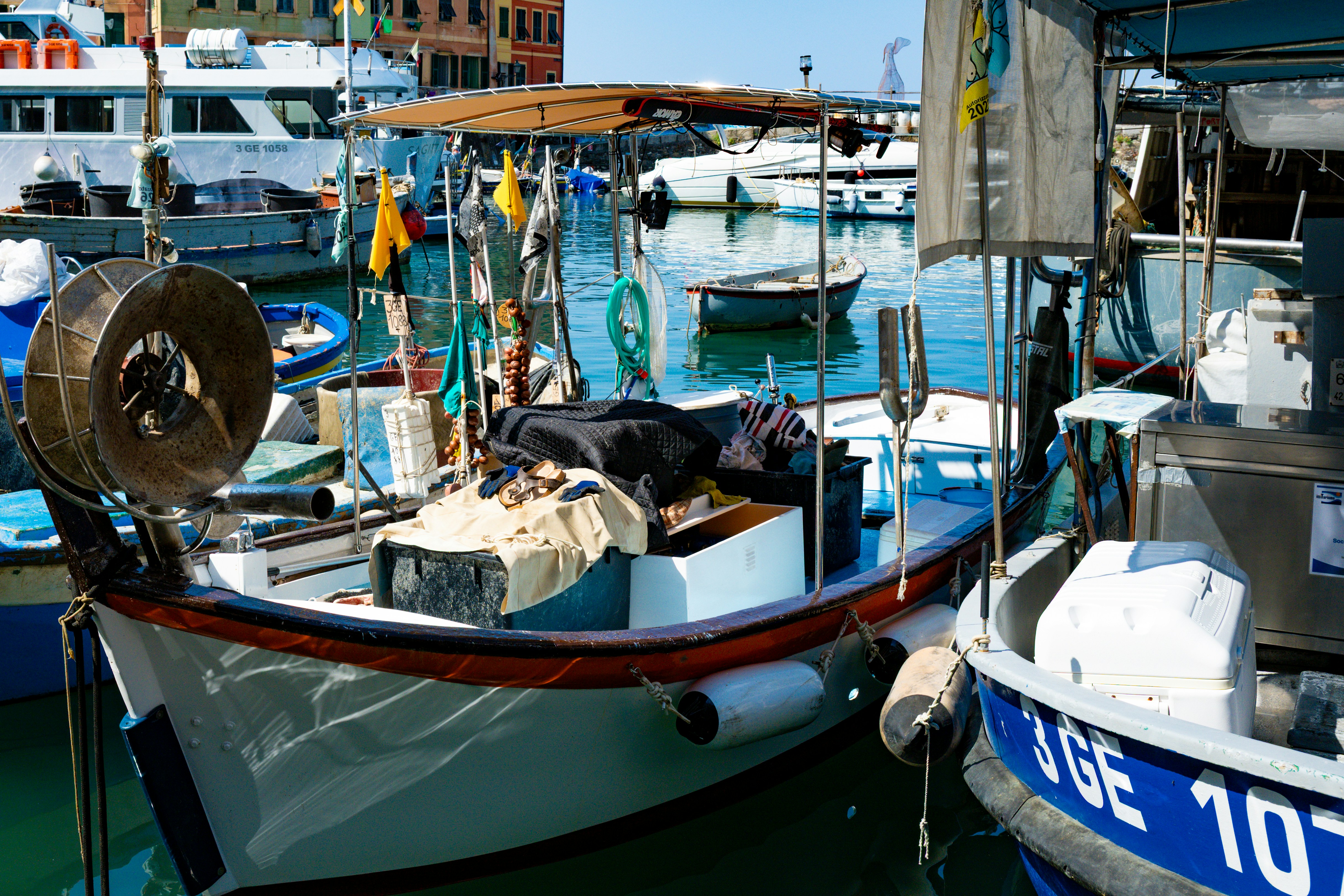 Harbor Craft: Sunlit Boats and Busy Tackle in a Colorful Marina