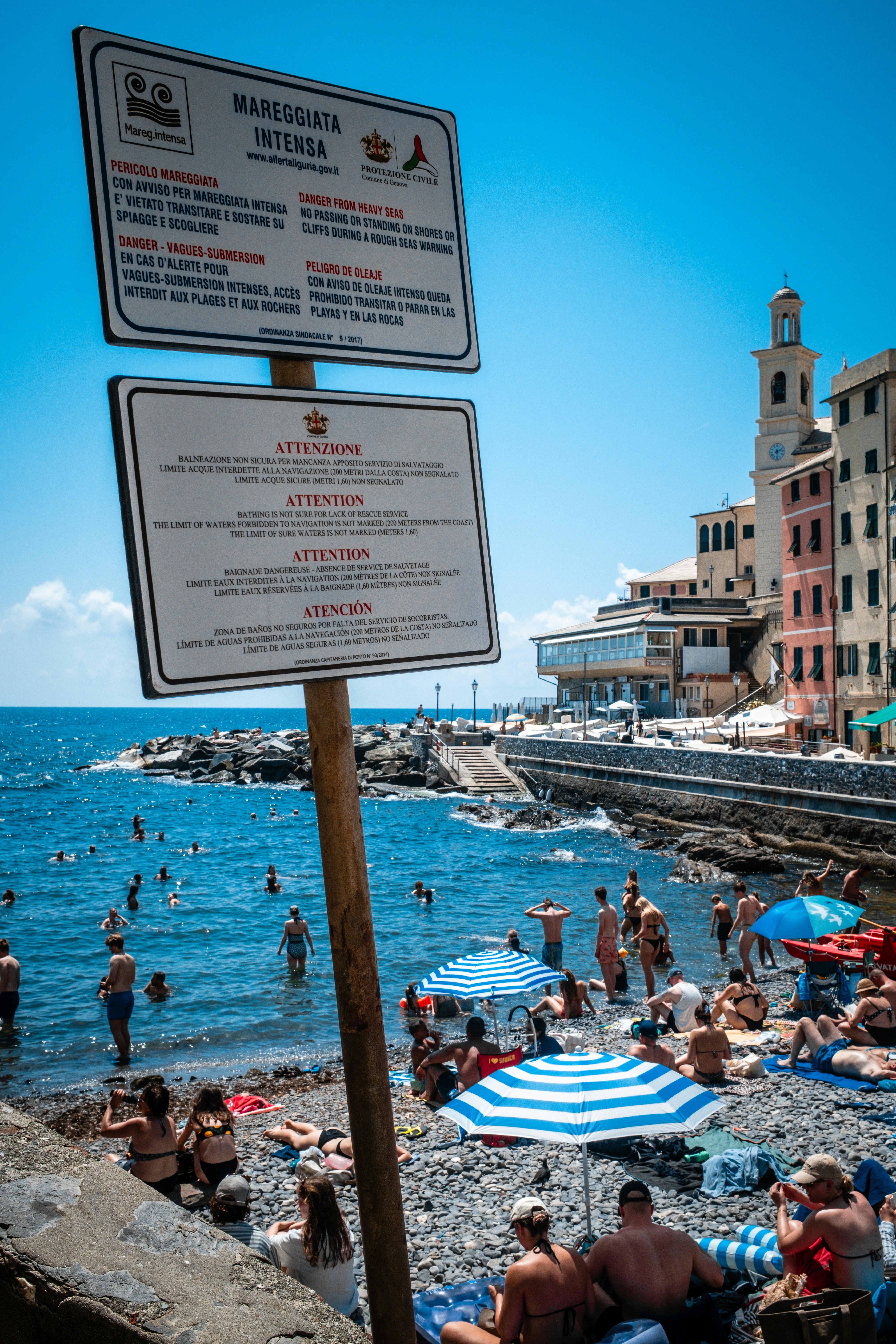 Sunlit Riviera: Beachgoers at a Vibrant Italian Seafront