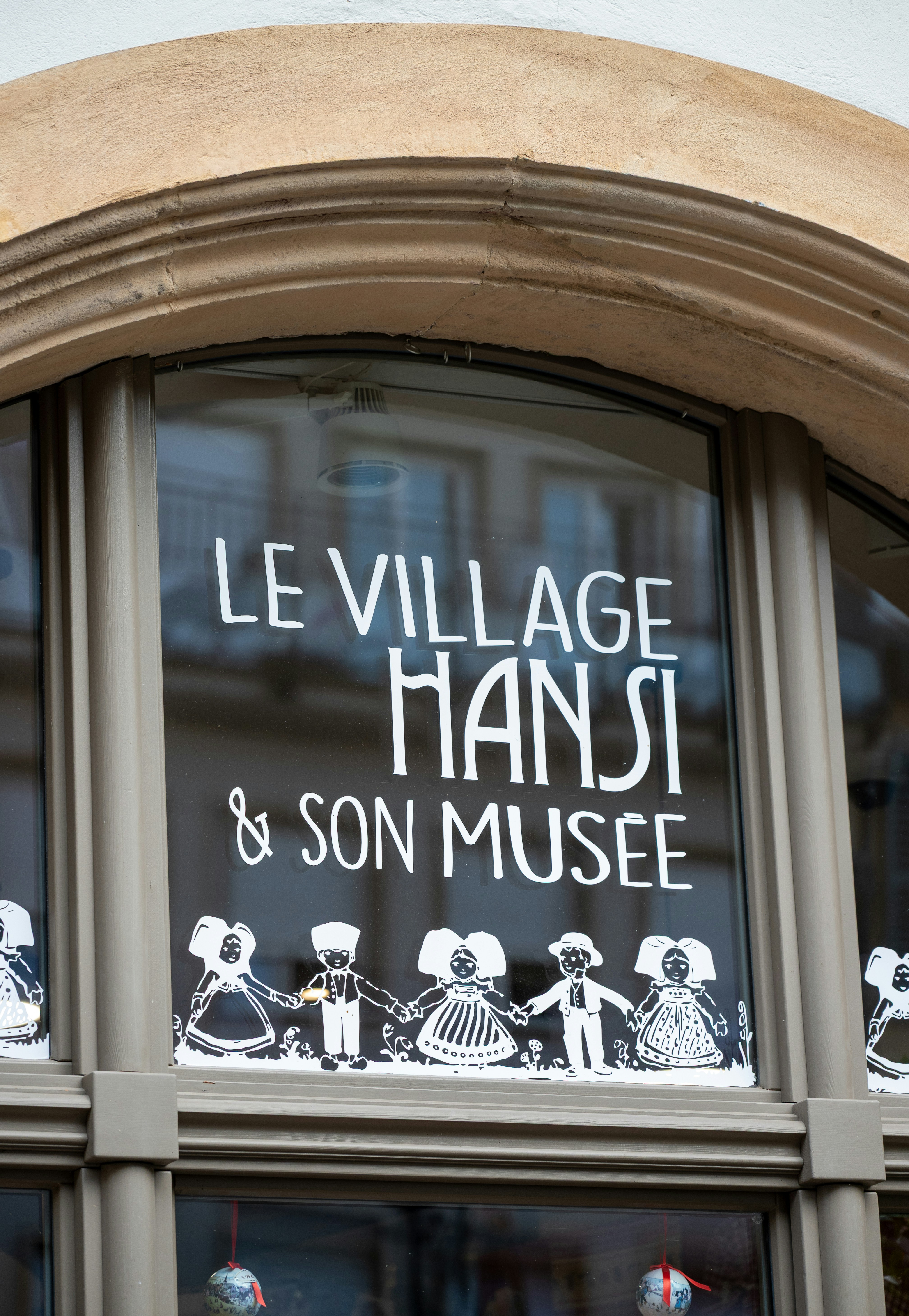 Le Village HanSi & Son Musee: Whimsical Window Script