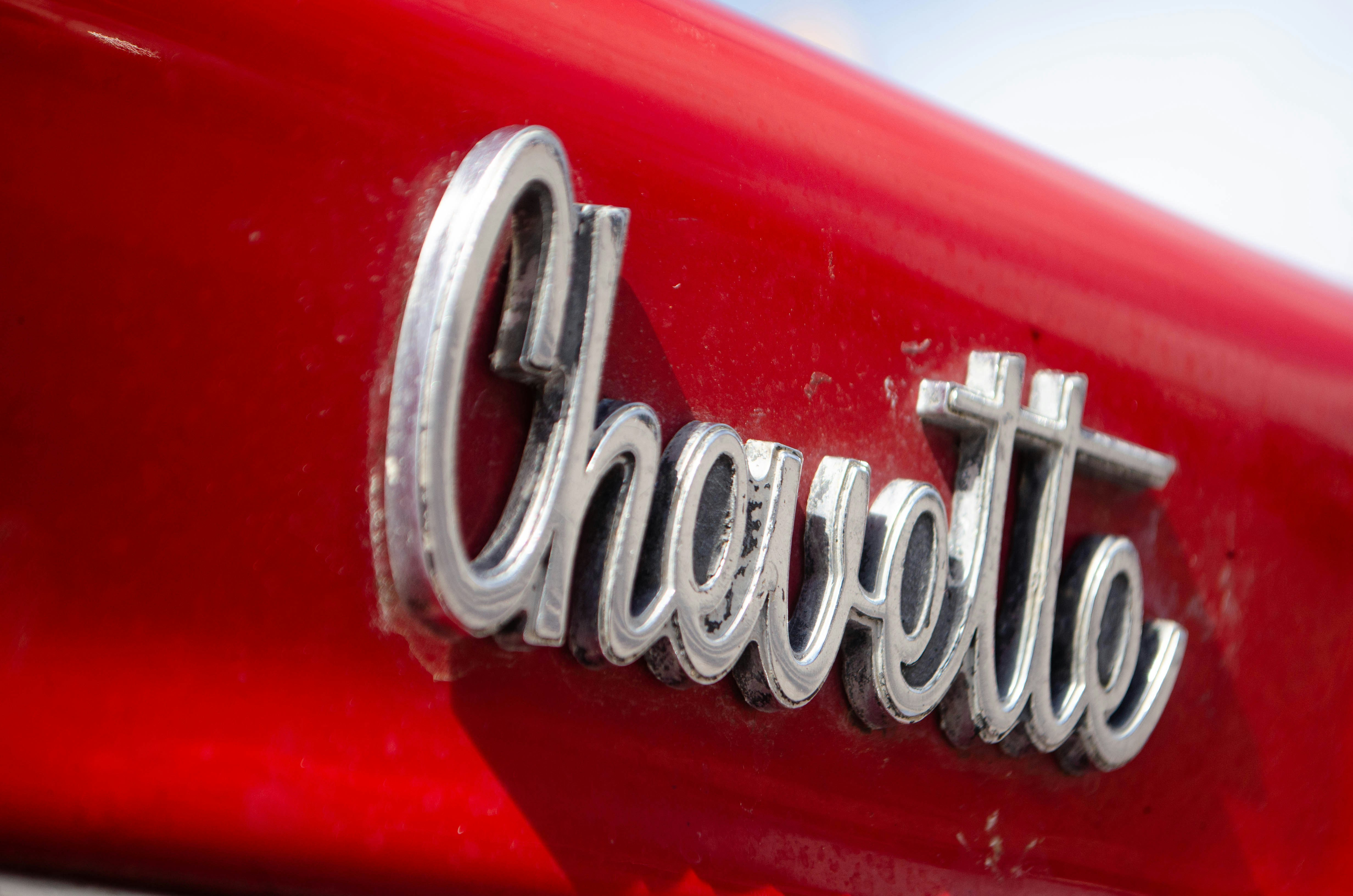 Chrome Script on Red Chrome: Chevrolet Badge Close-Up