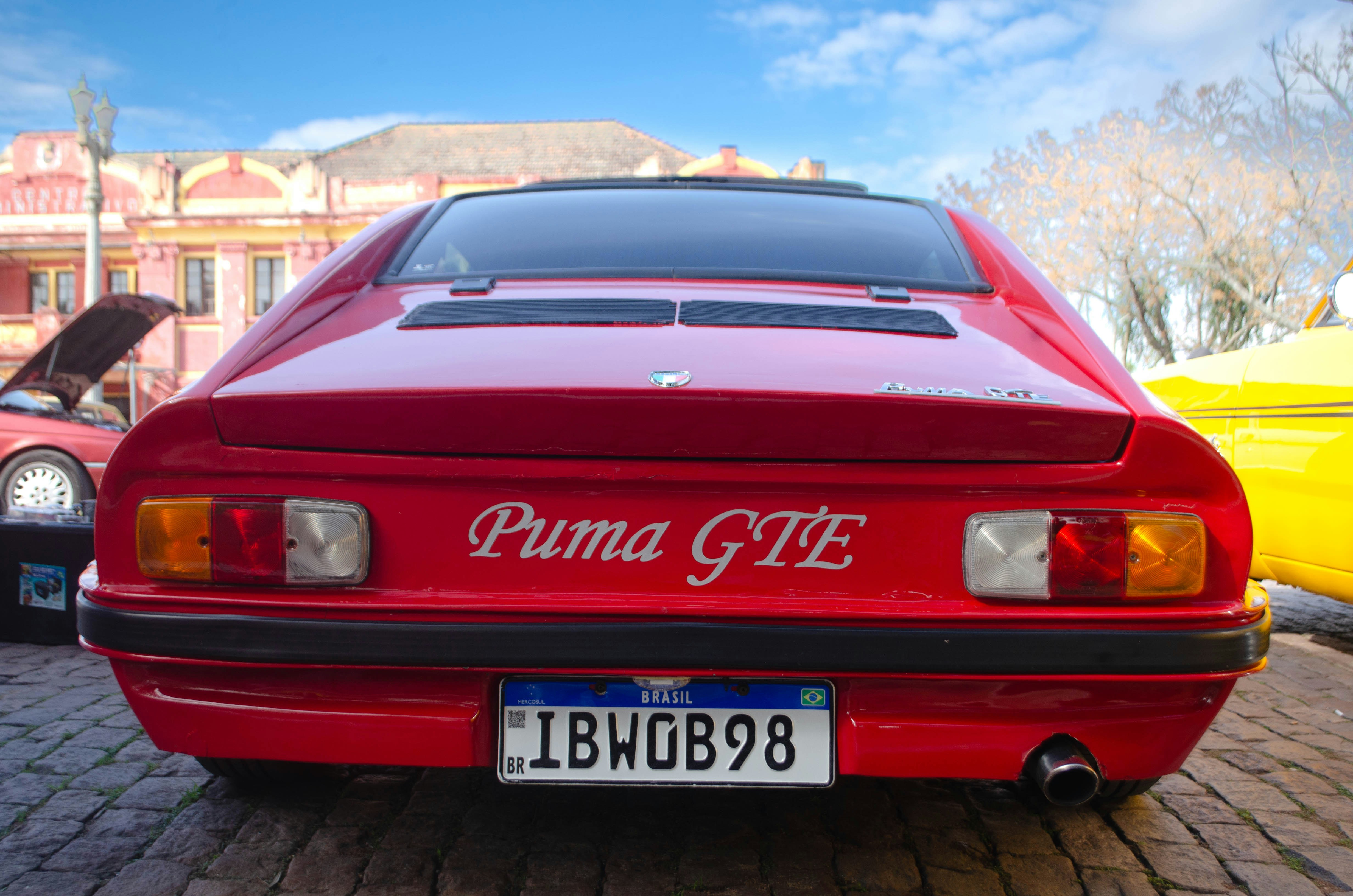 Rear View of a Red Puma GT E Car at a Classic Car Show