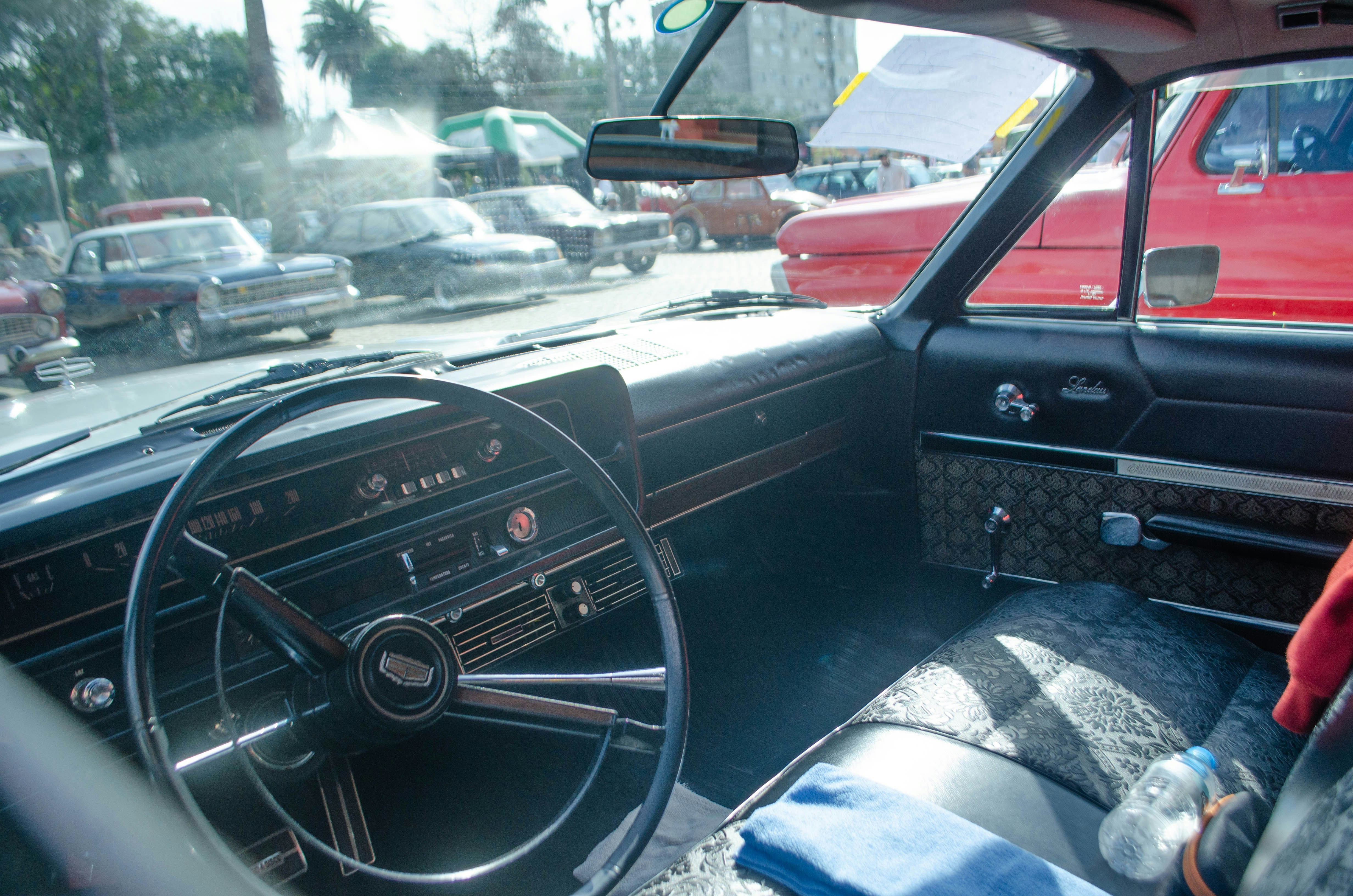 Vintage Car Dashboard Dreams: A Quiet Street Reflected in Chrome