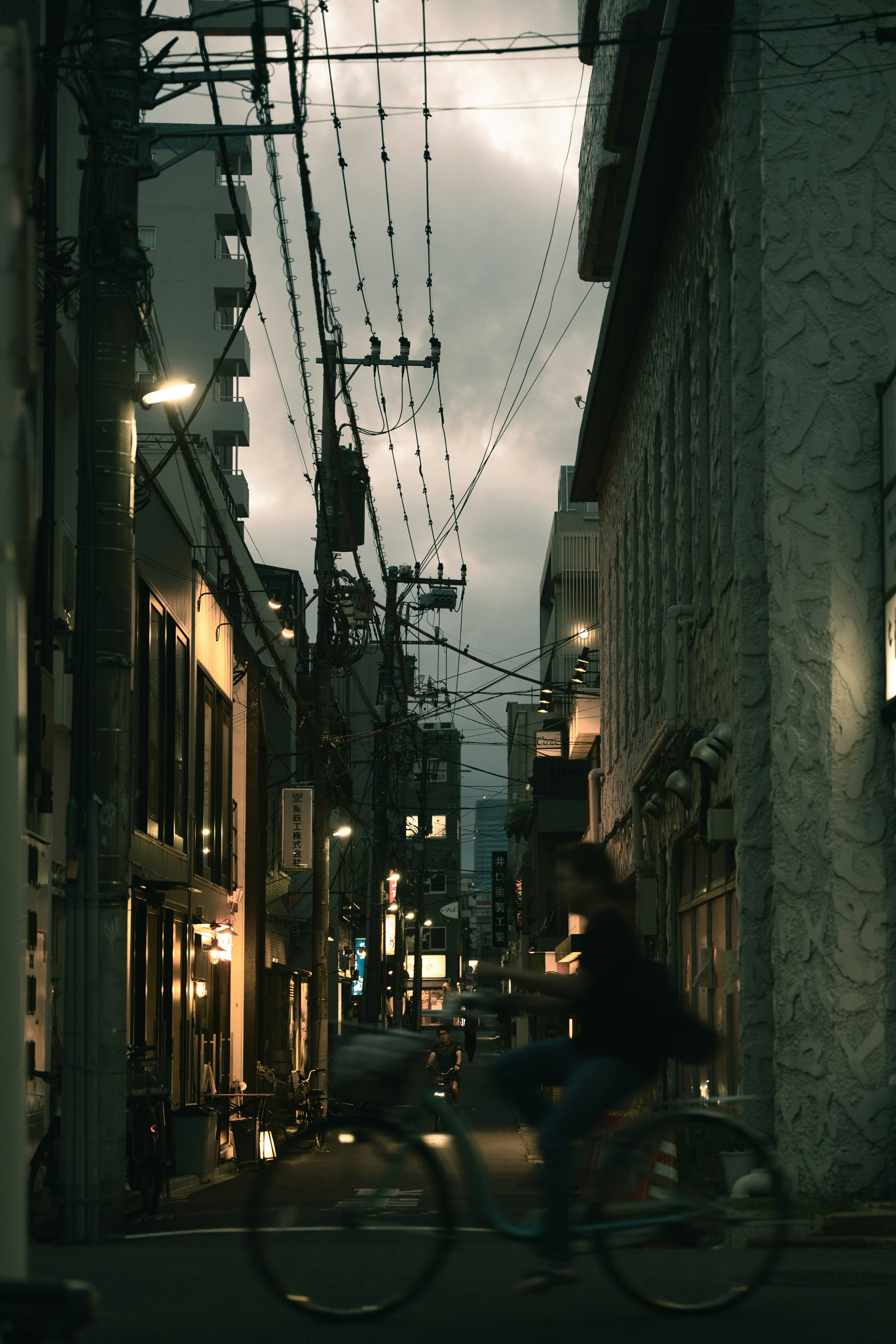 Night Ride Through a Narrow City Alley