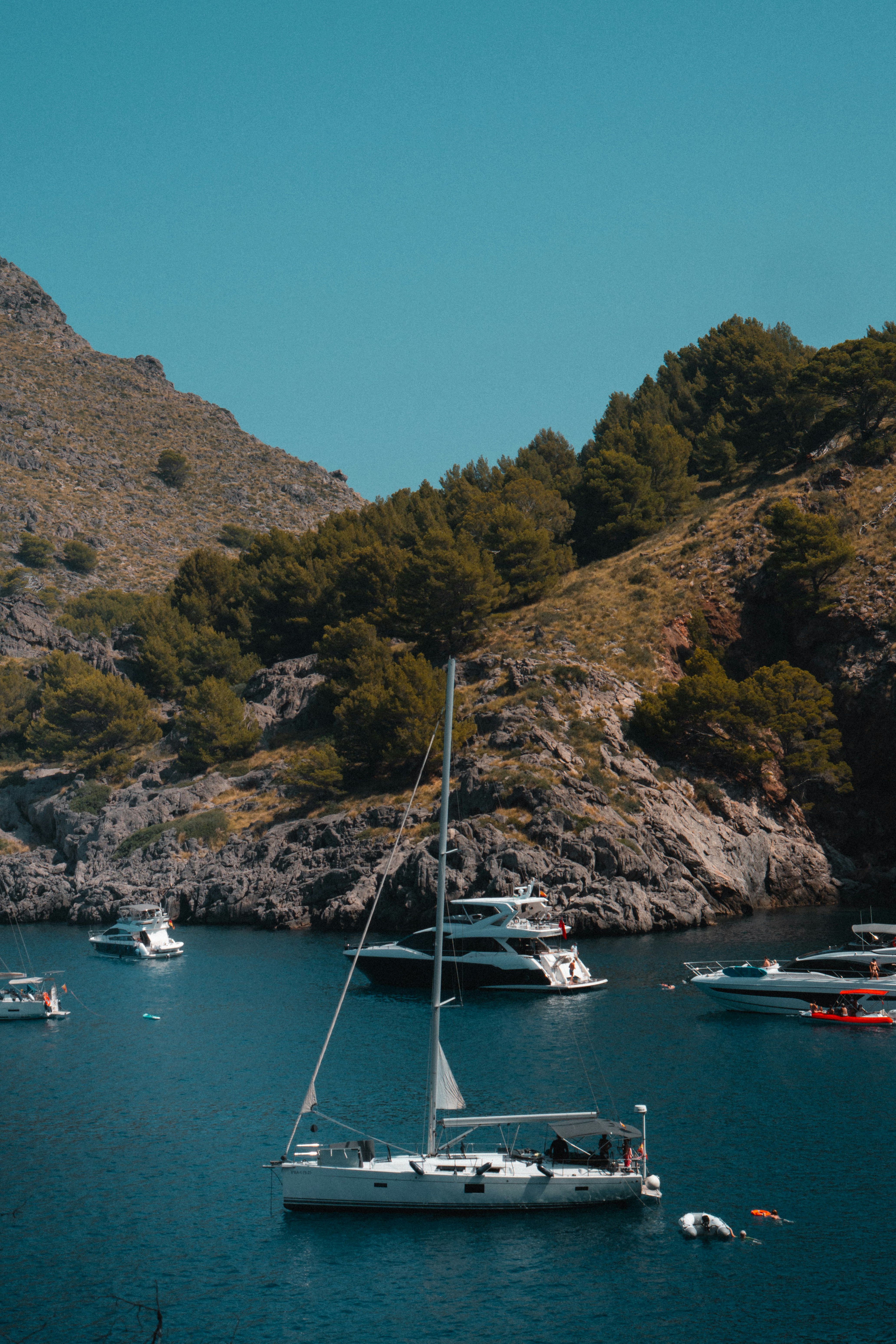 Sailboats Resting in a Cove Between Stone Hills