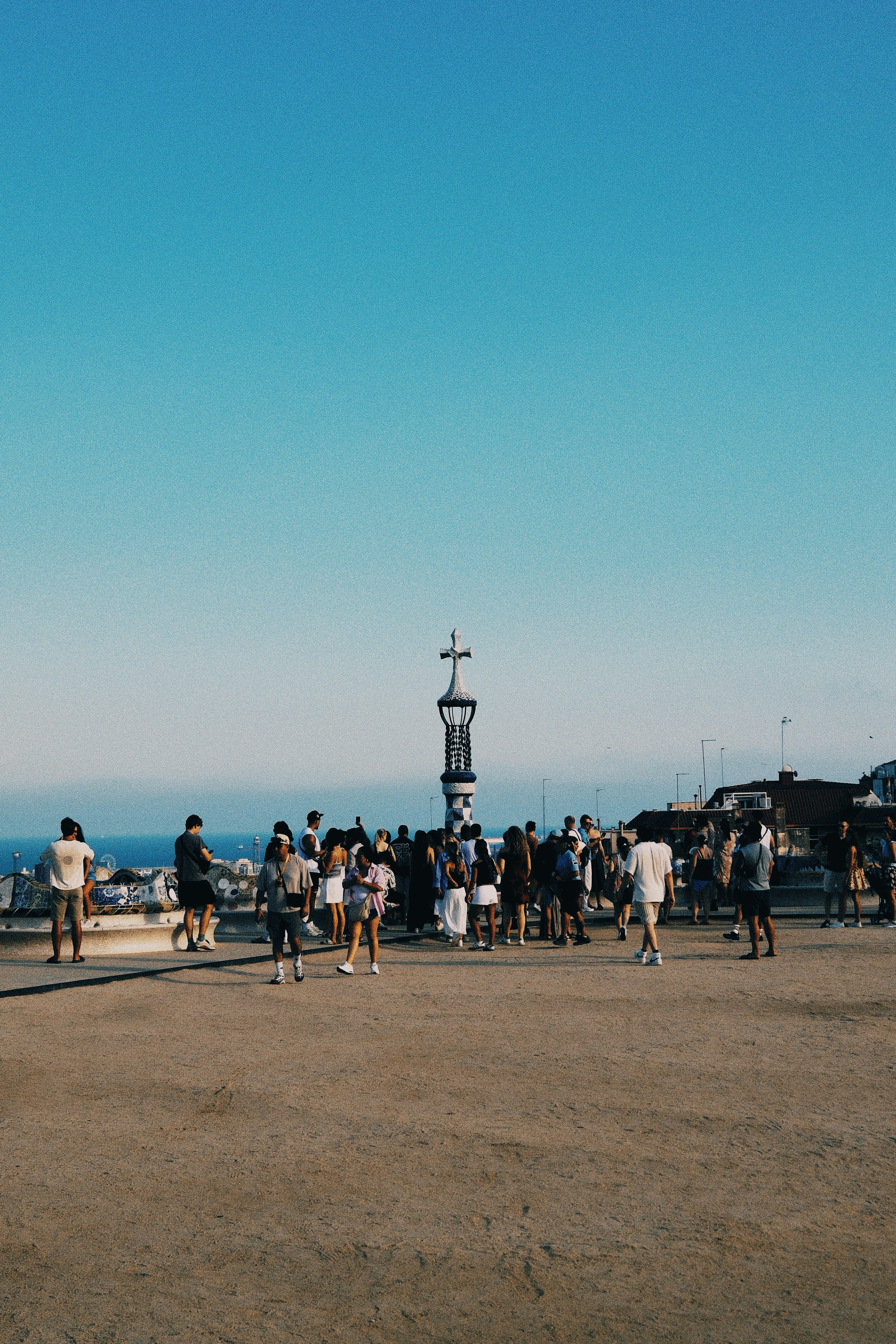 Coastal Crowd Beneath a Central Lantern