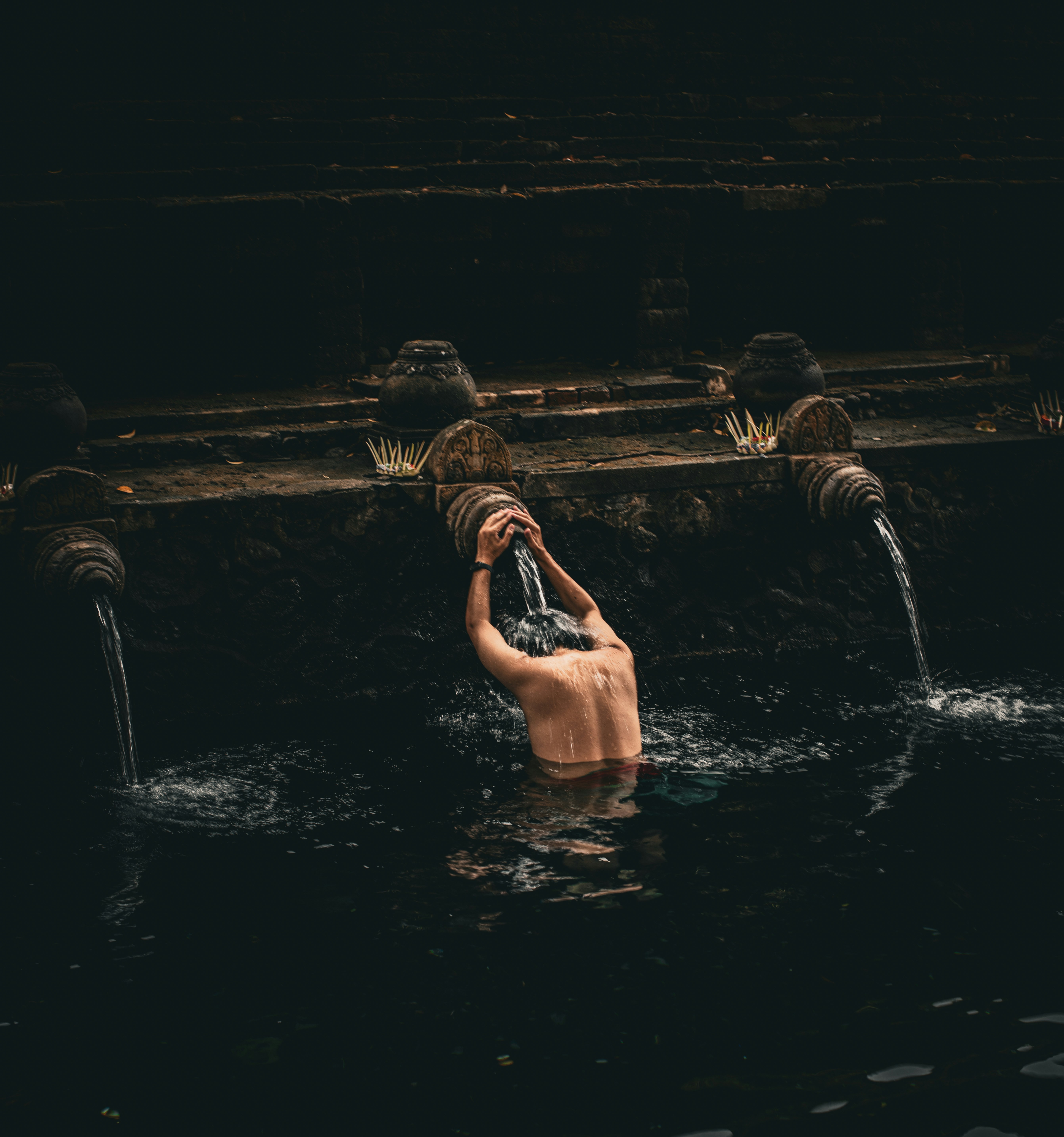 Cleansing in the Quiet Pool: A Man at the Water Spout