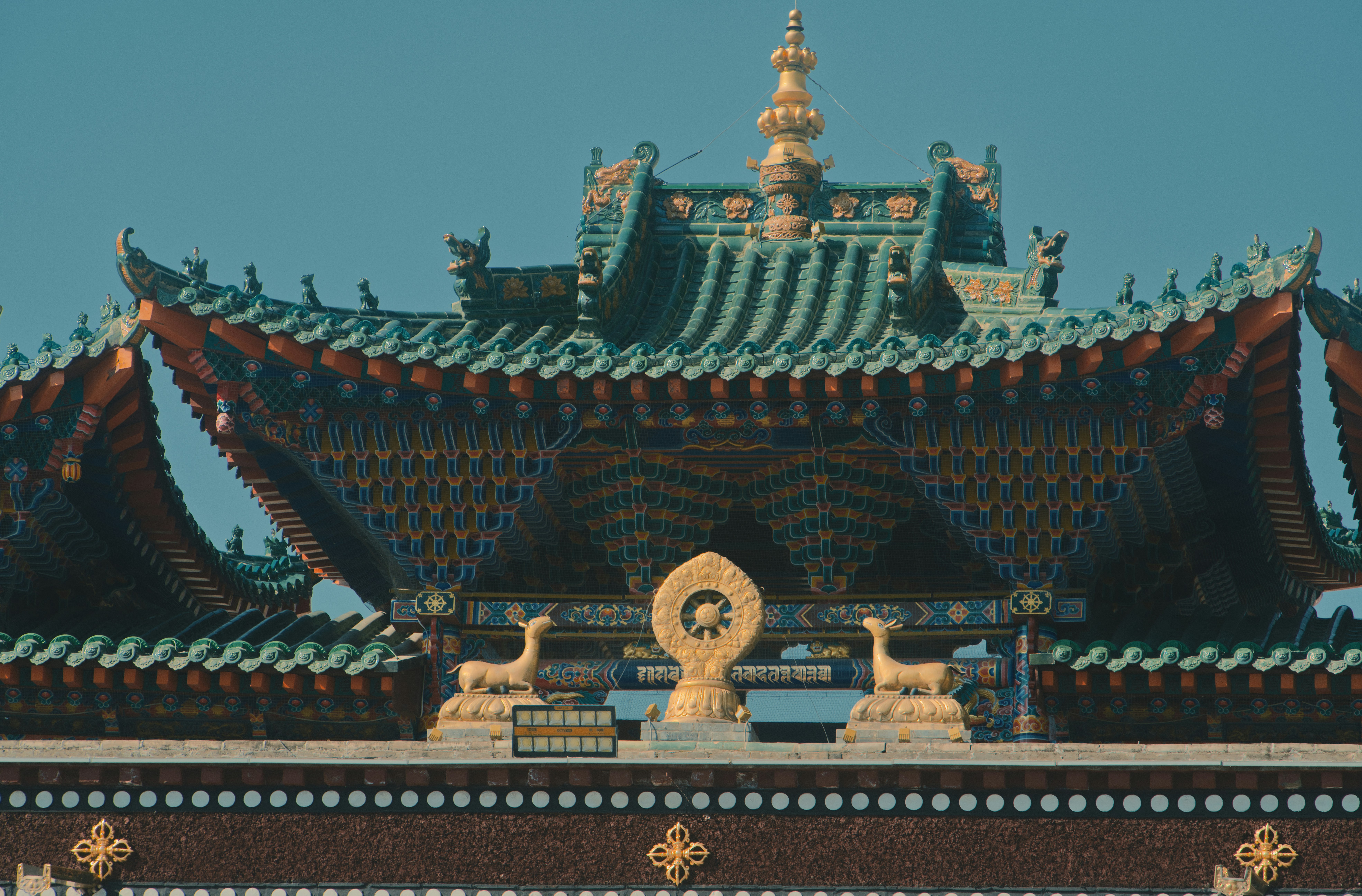 Ornate Temple Roof: A Moment Under the Green-Tiled Eaves
