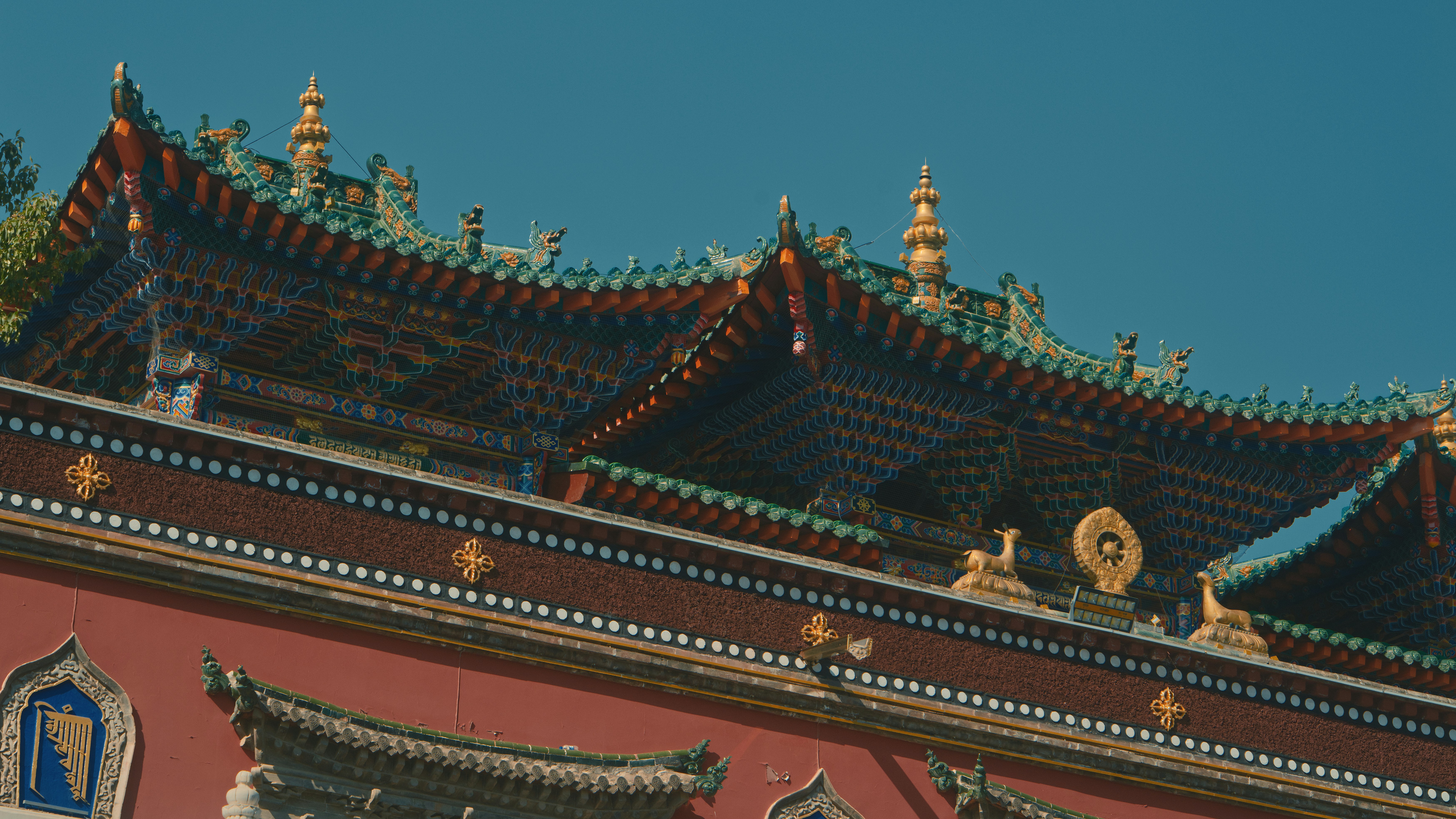 Ornate Rooflines: A Traditional Chinese Temple Crest in Clear Sky