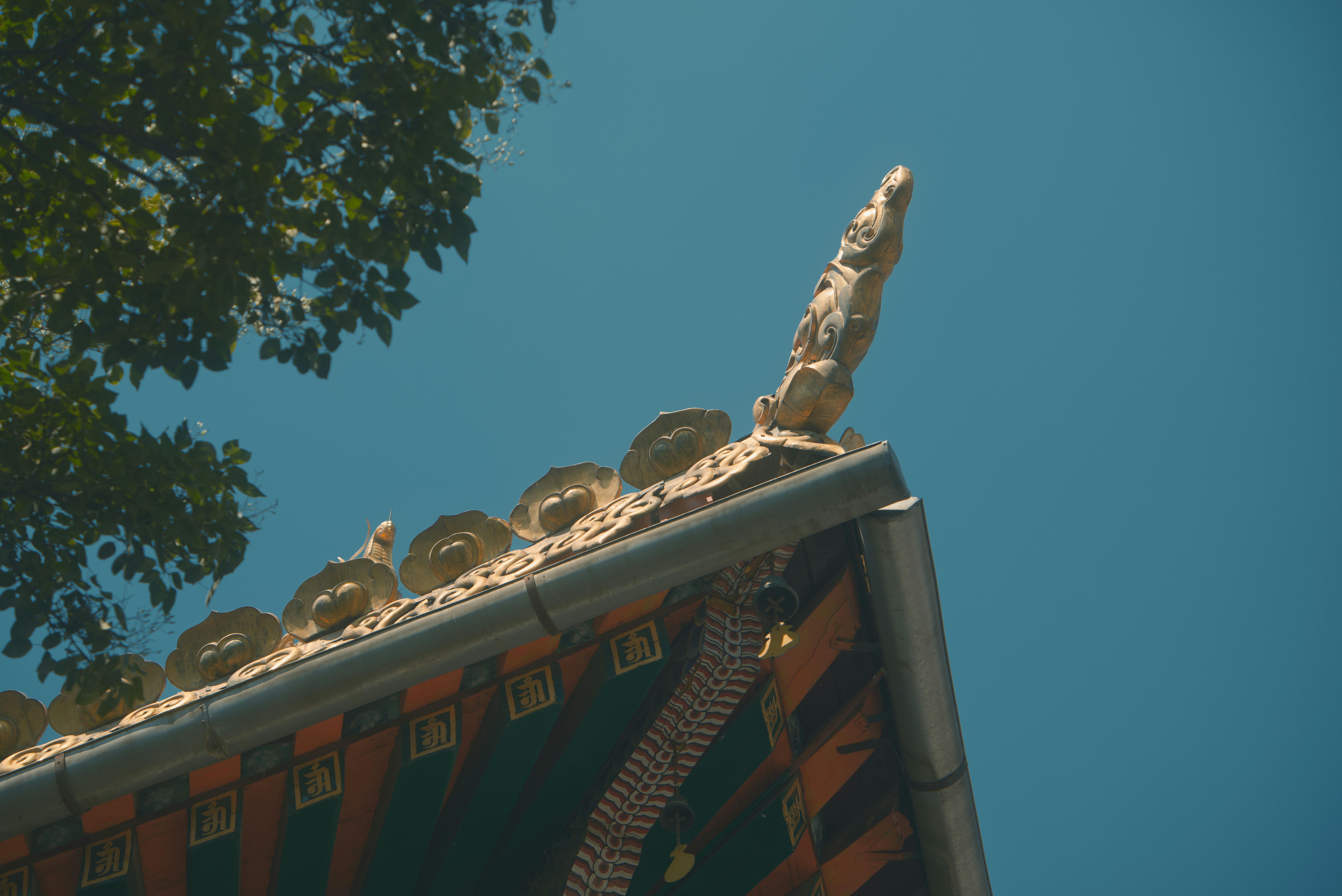 Corner Chimneyline: Traditional Roof Ornament Against Sky