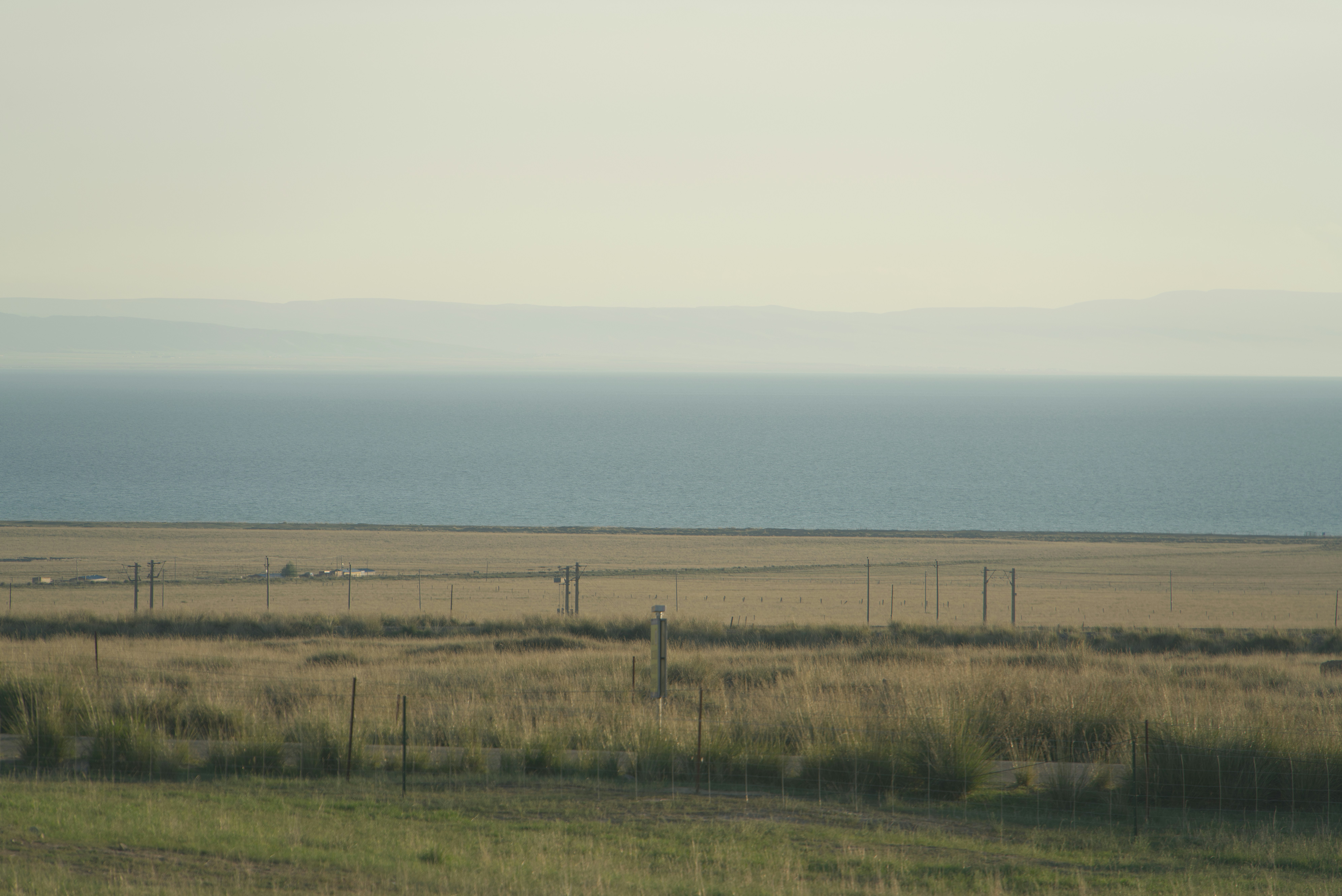 Horizon Field: Quiet Seascape Beneath a Pale Skyscape