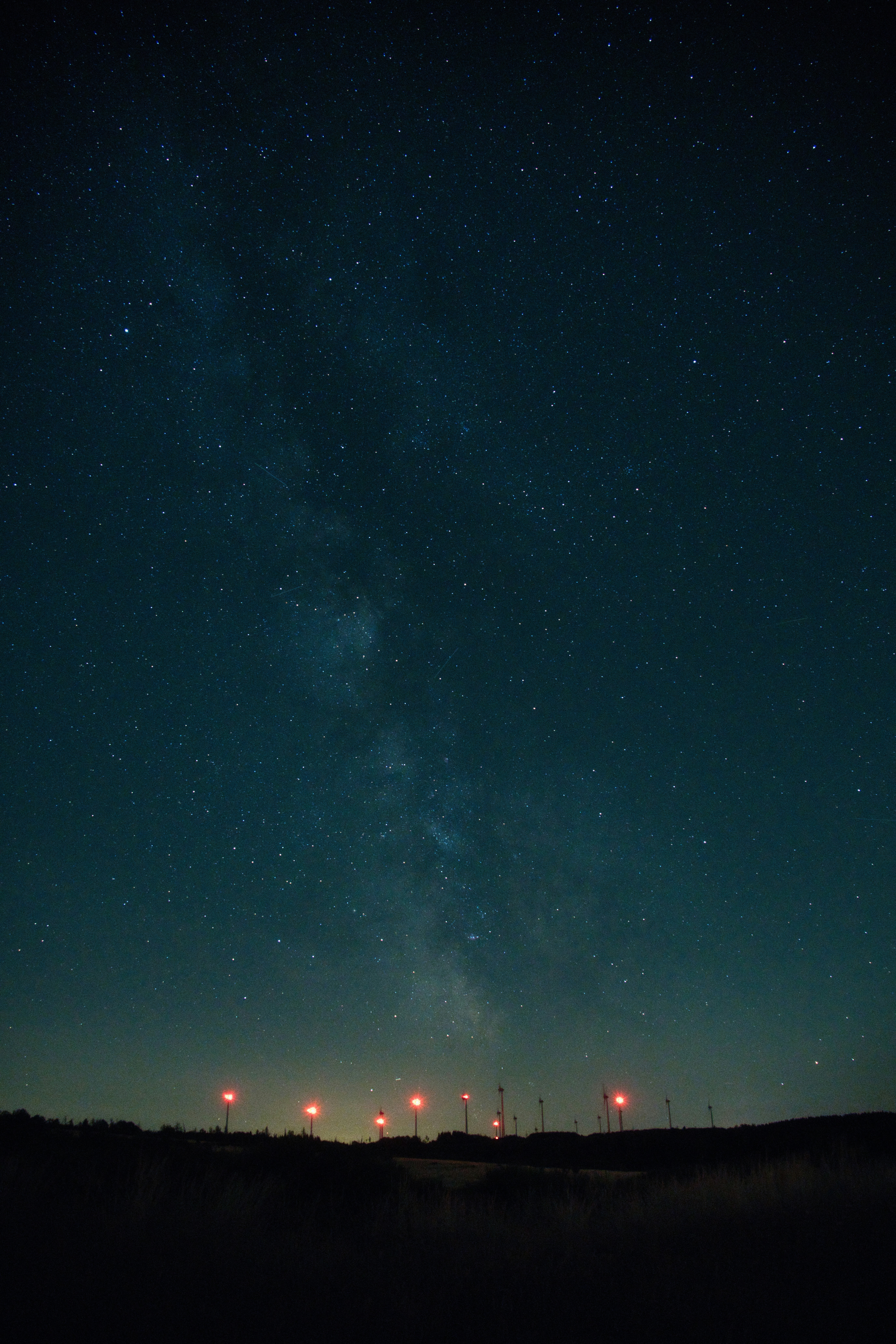 Night Sky Over Wind Farm: A Silent Milky Way Above Quiet Lights