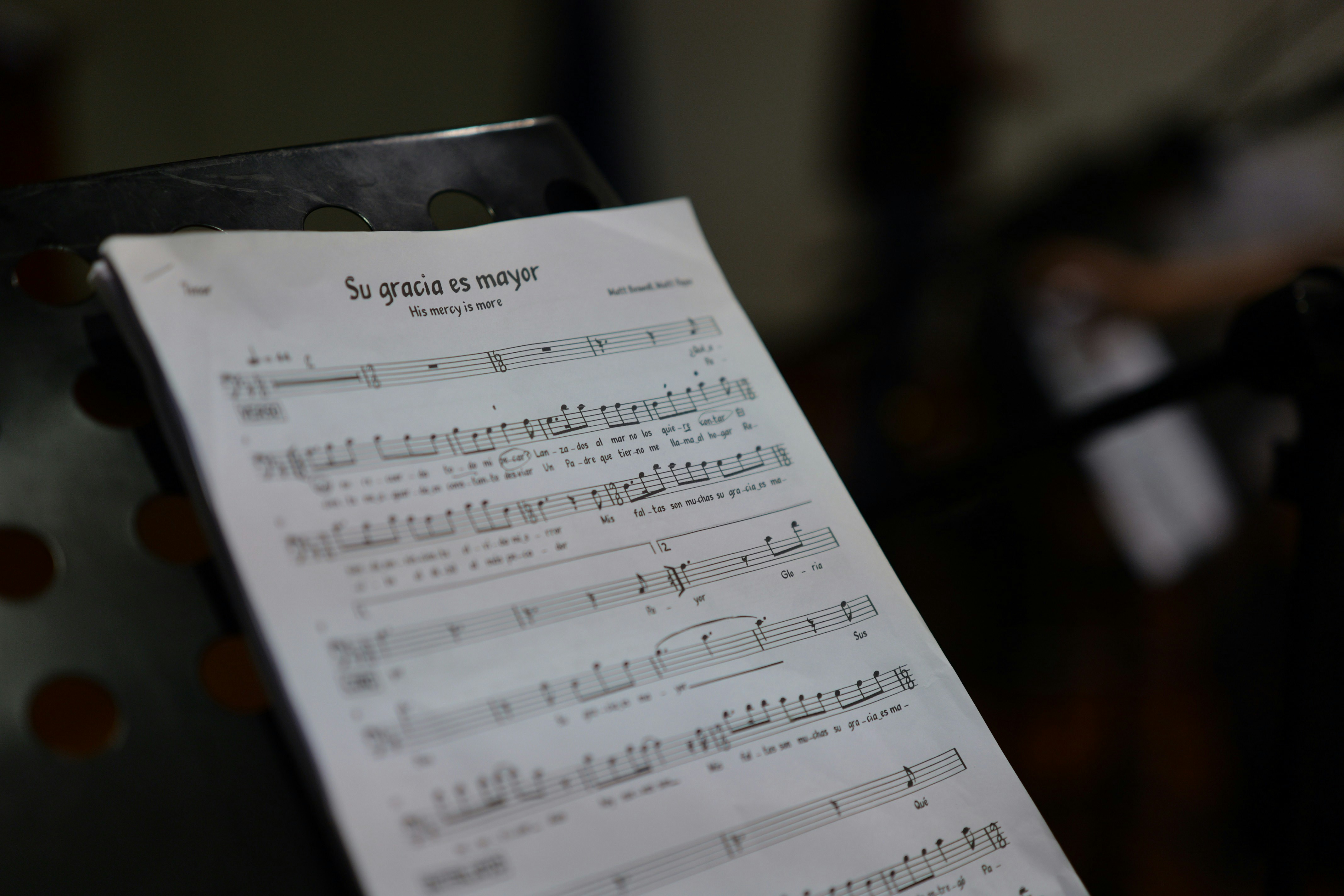 Sheet Music in Focus: A Music Stand in a Dim Studio
