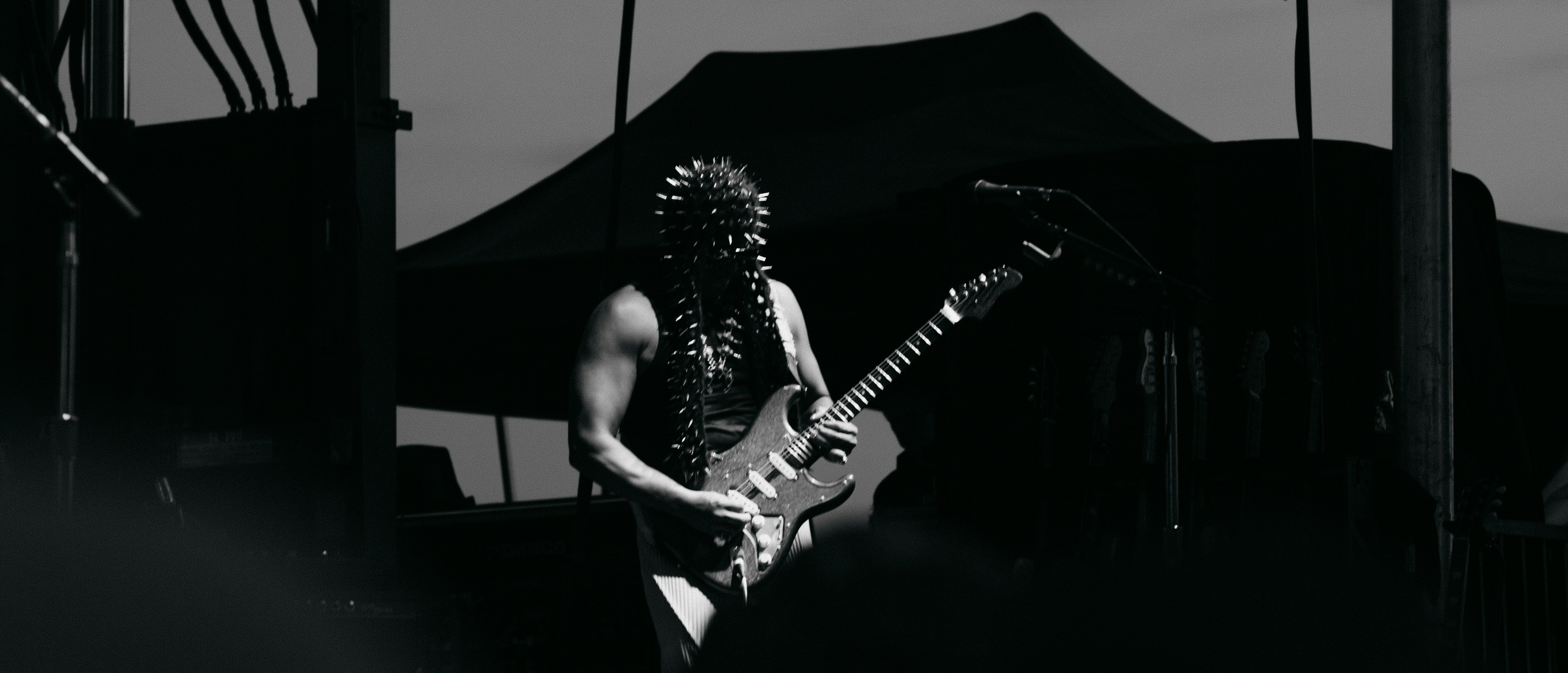 Guitar Hero in Shadow: A Glimmer of Stage Intensity