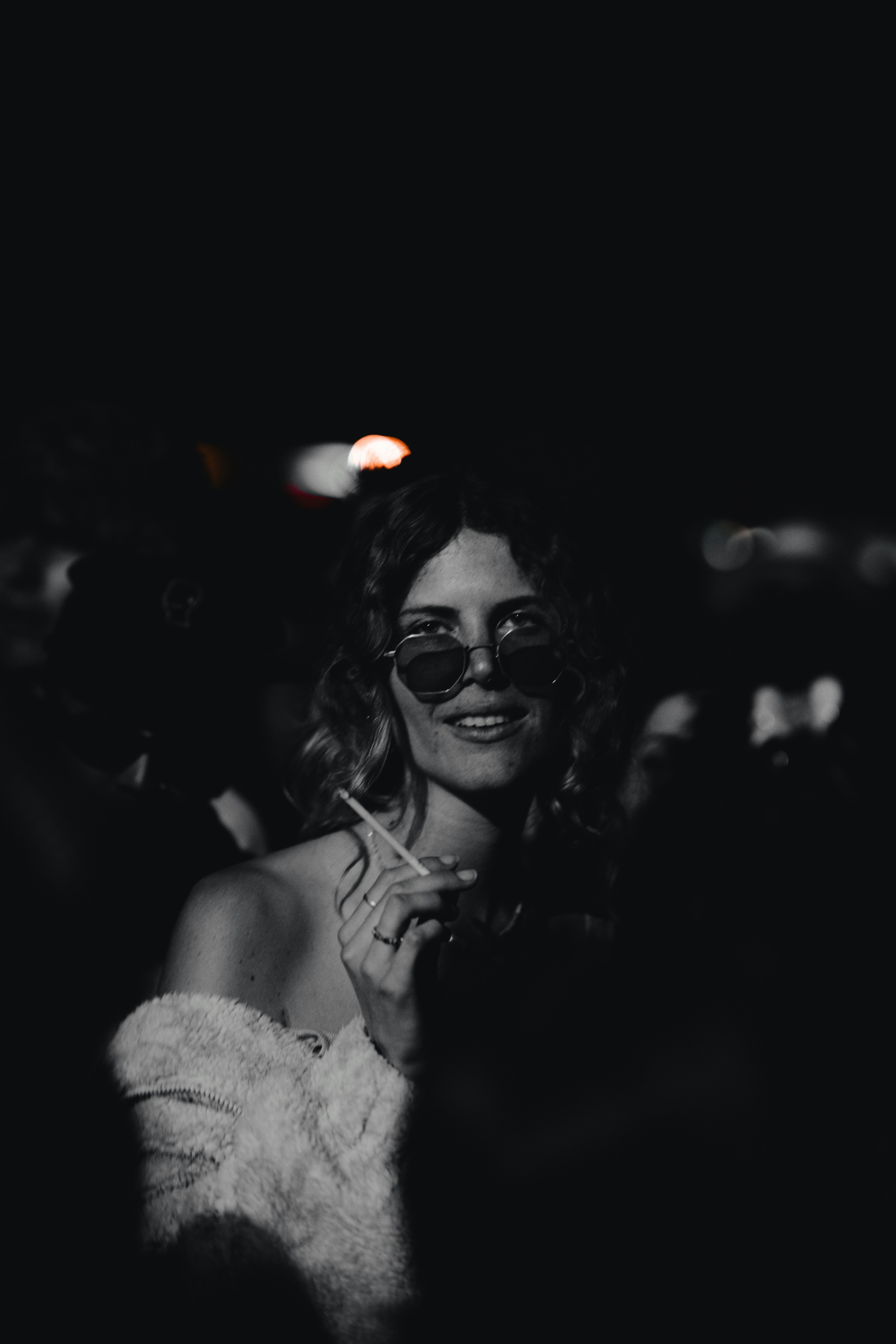 Midnight Glow: A Confident Smile in the Crowd