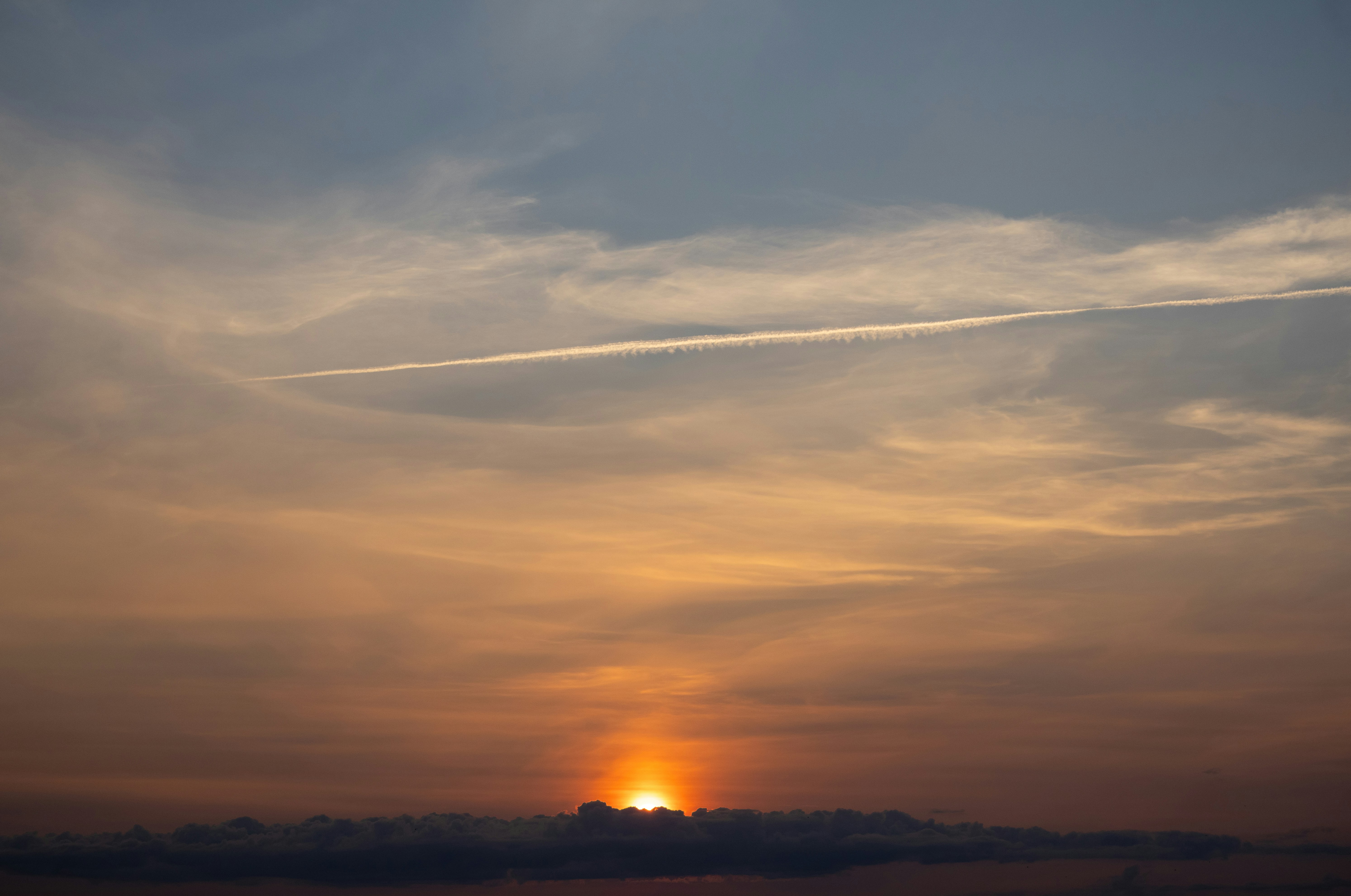 Sunrise on the Horizon: Quiet Fire at Distant Sea Level