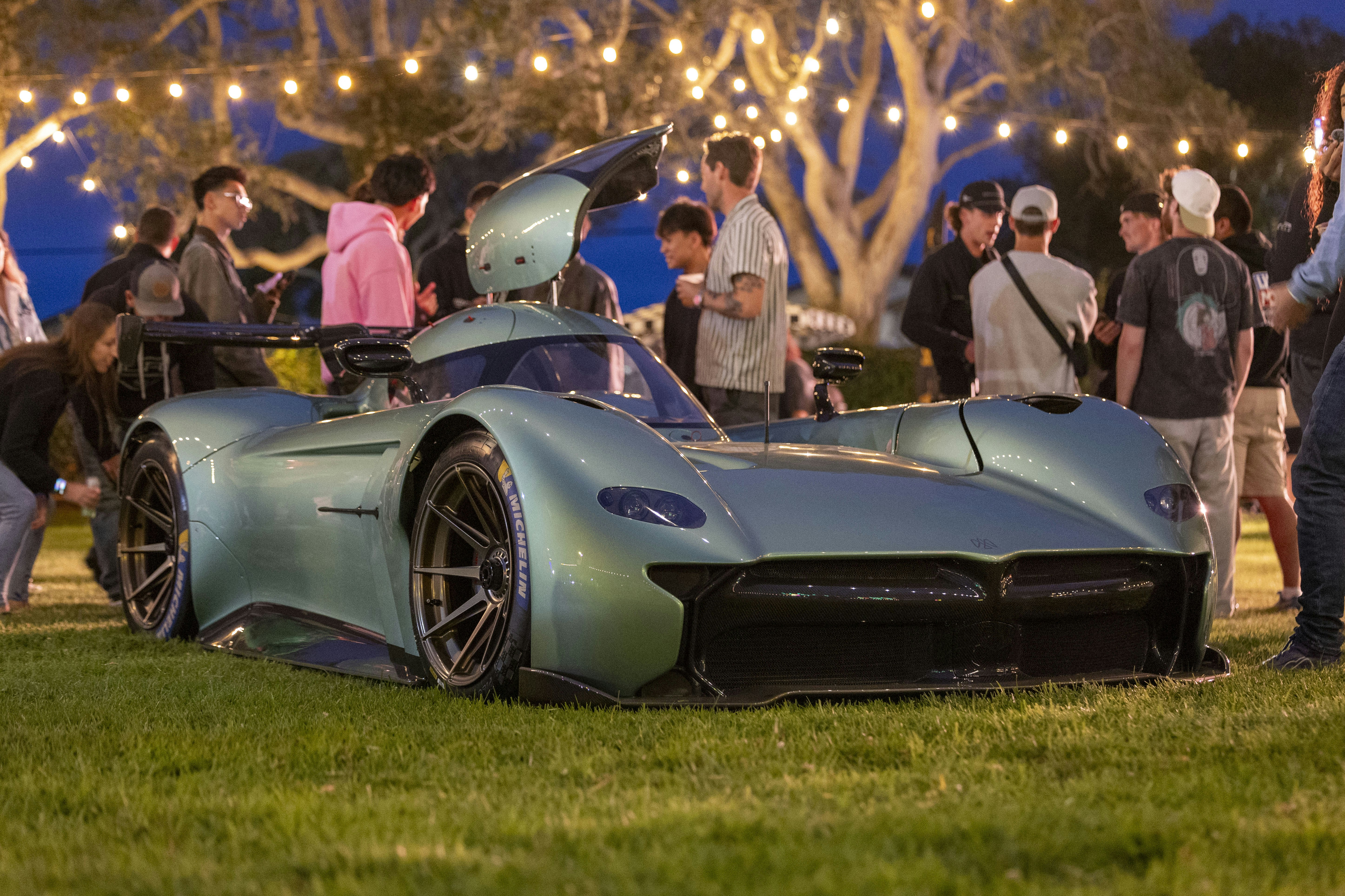 Midnight Showpiece: The Battle-Scarred Hypercar Amid Curious Onlookers