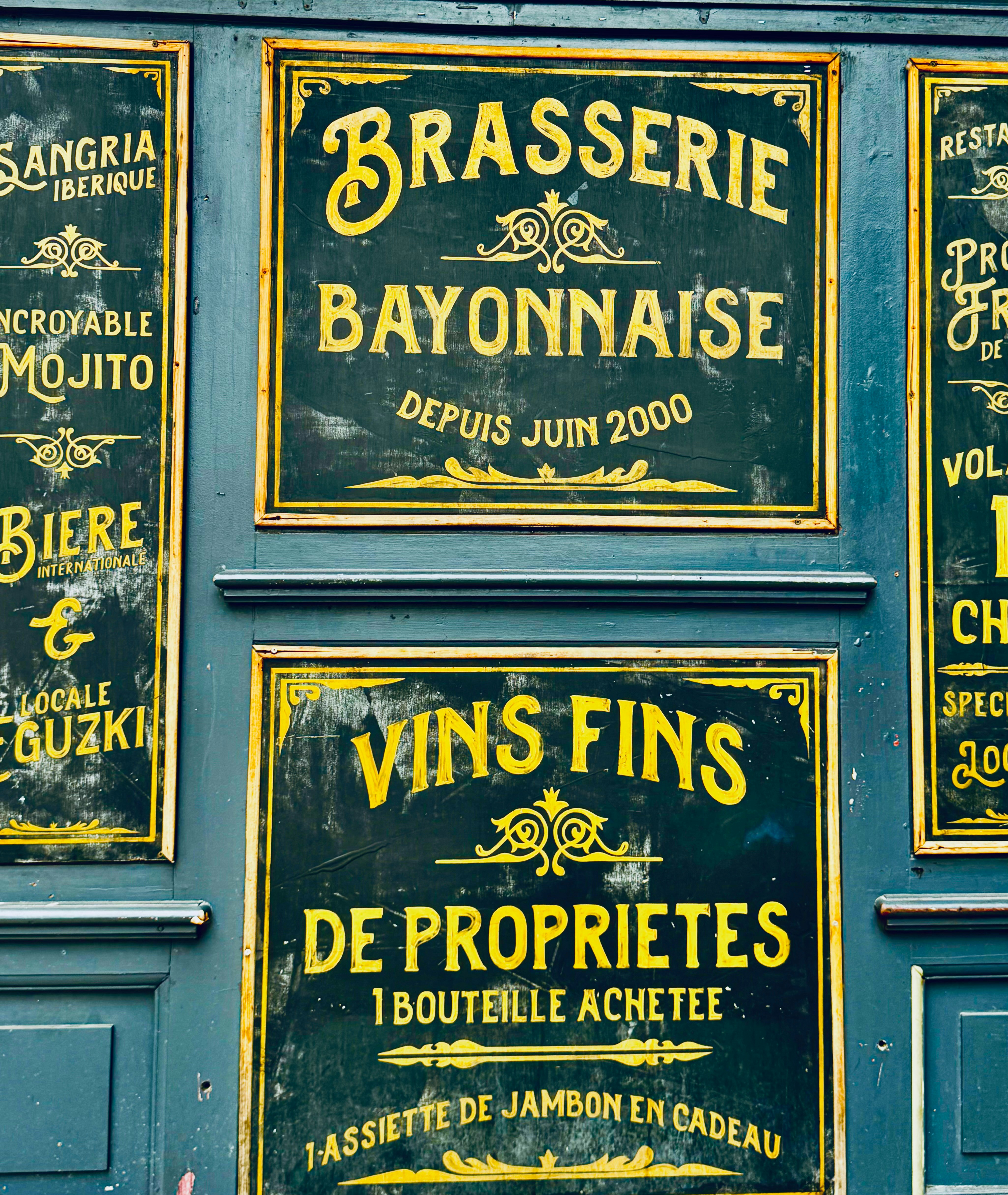 Brasserie Bayonnaise: A Weathered Palette of French Signage