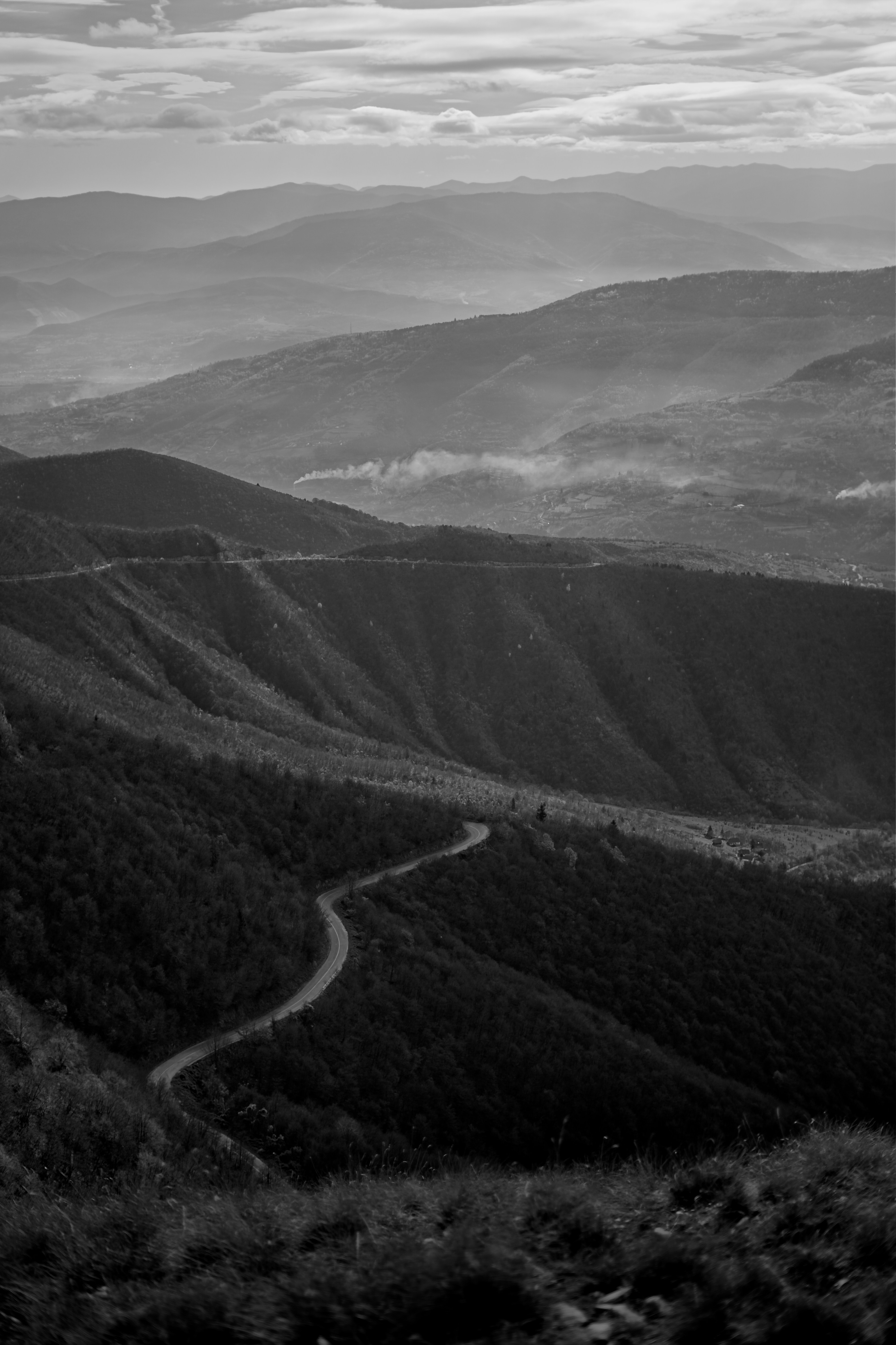 Winding ridge through a fog-kissed mountain pass