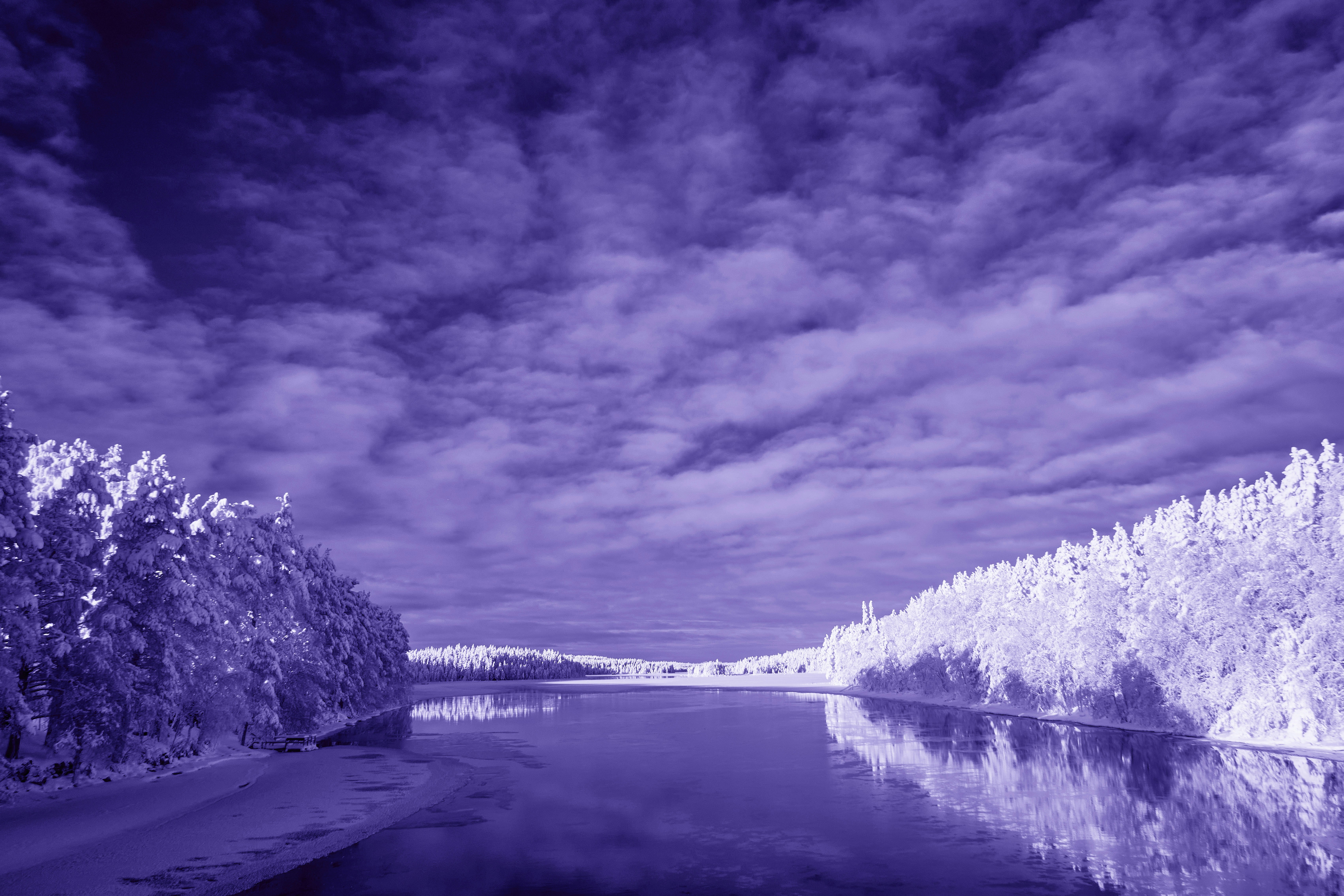 Purple River Reflects: A Twilight Panorama Over Frosted Banks