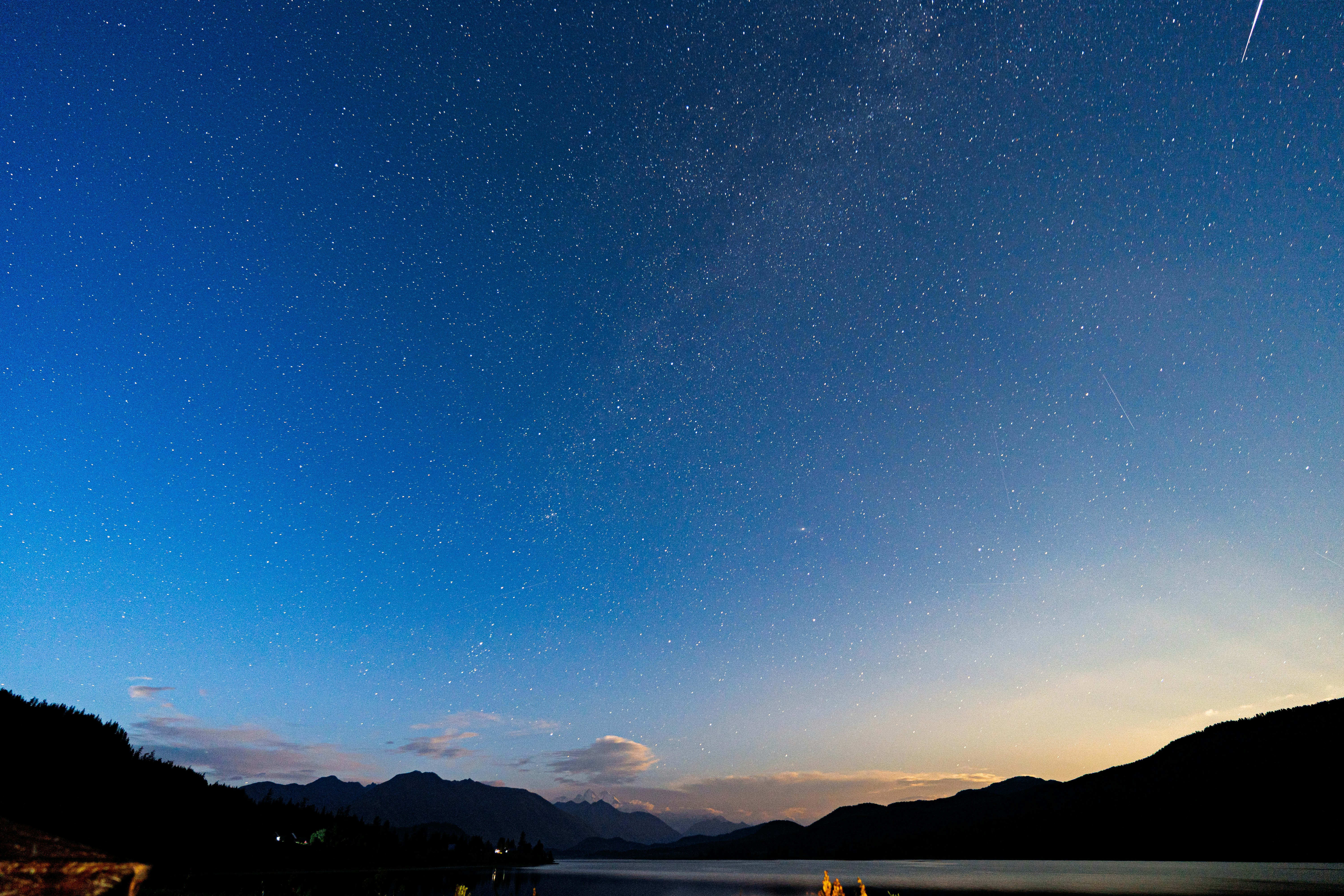 Starlit Horizon over Quiet Water