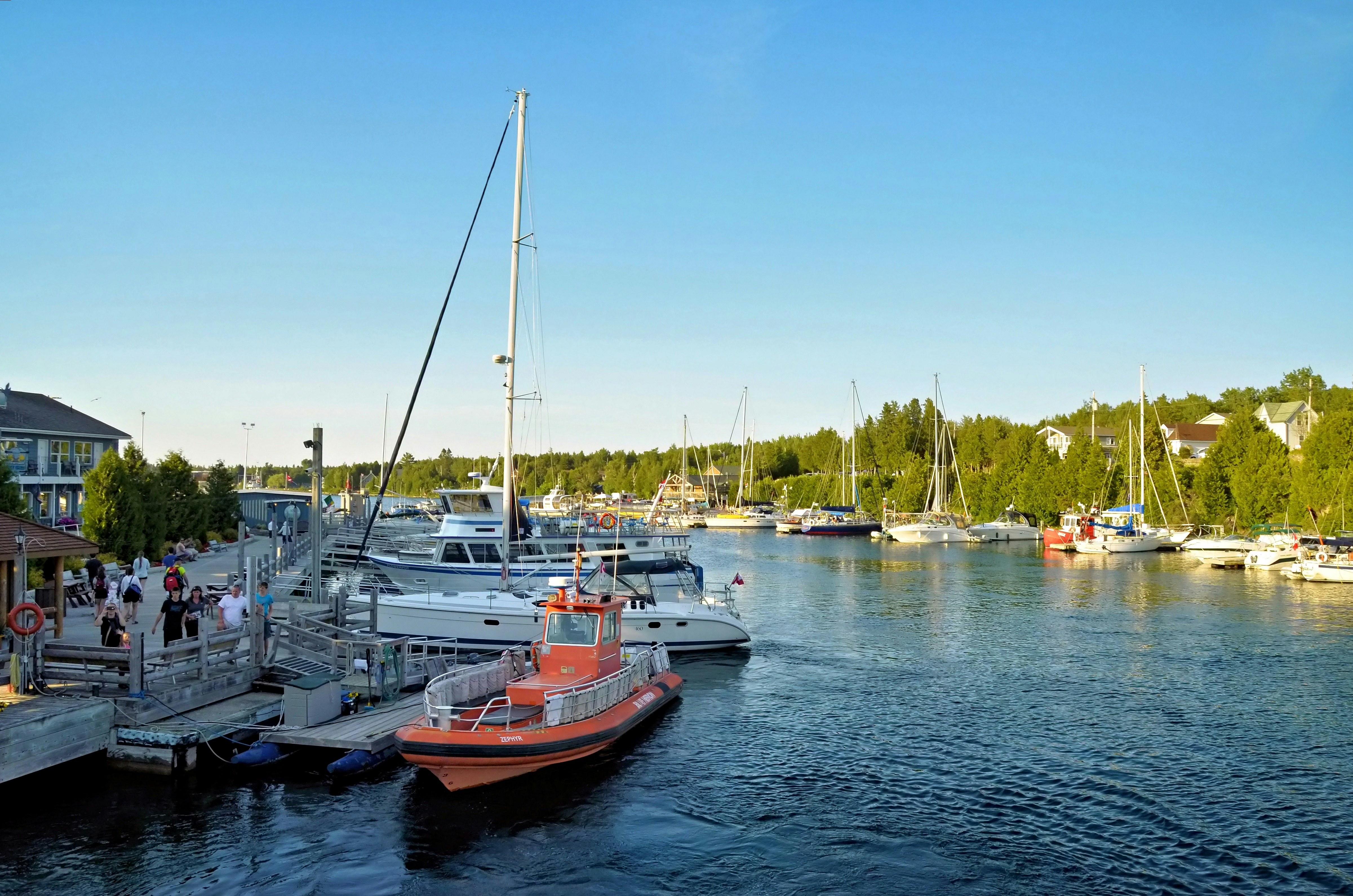 Harbor of Sails and Steel: Boats Docked at a Quiet Waterway