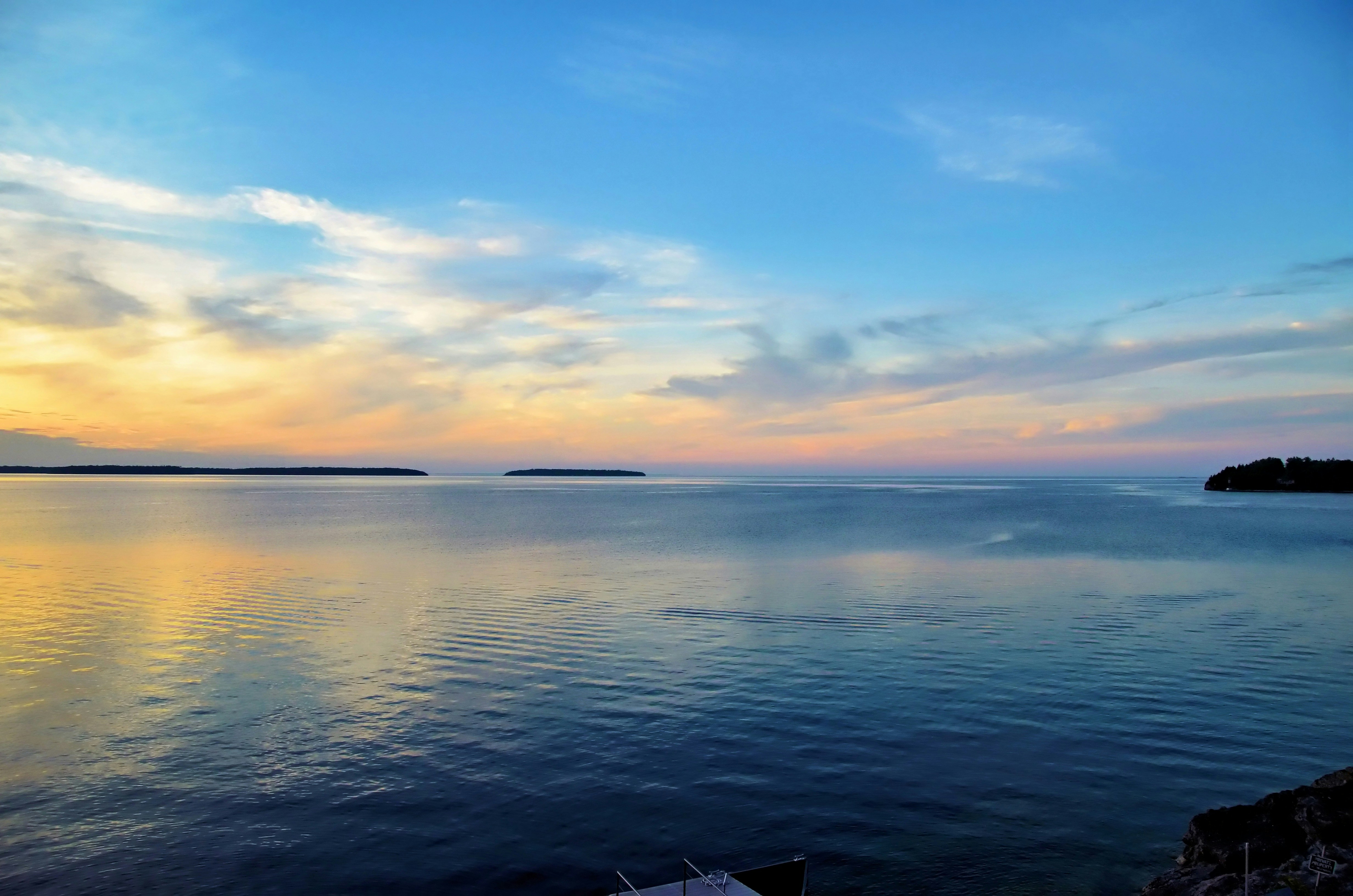 Dusk over a Quiet Bay: Velvet Water and Gentle Skies
