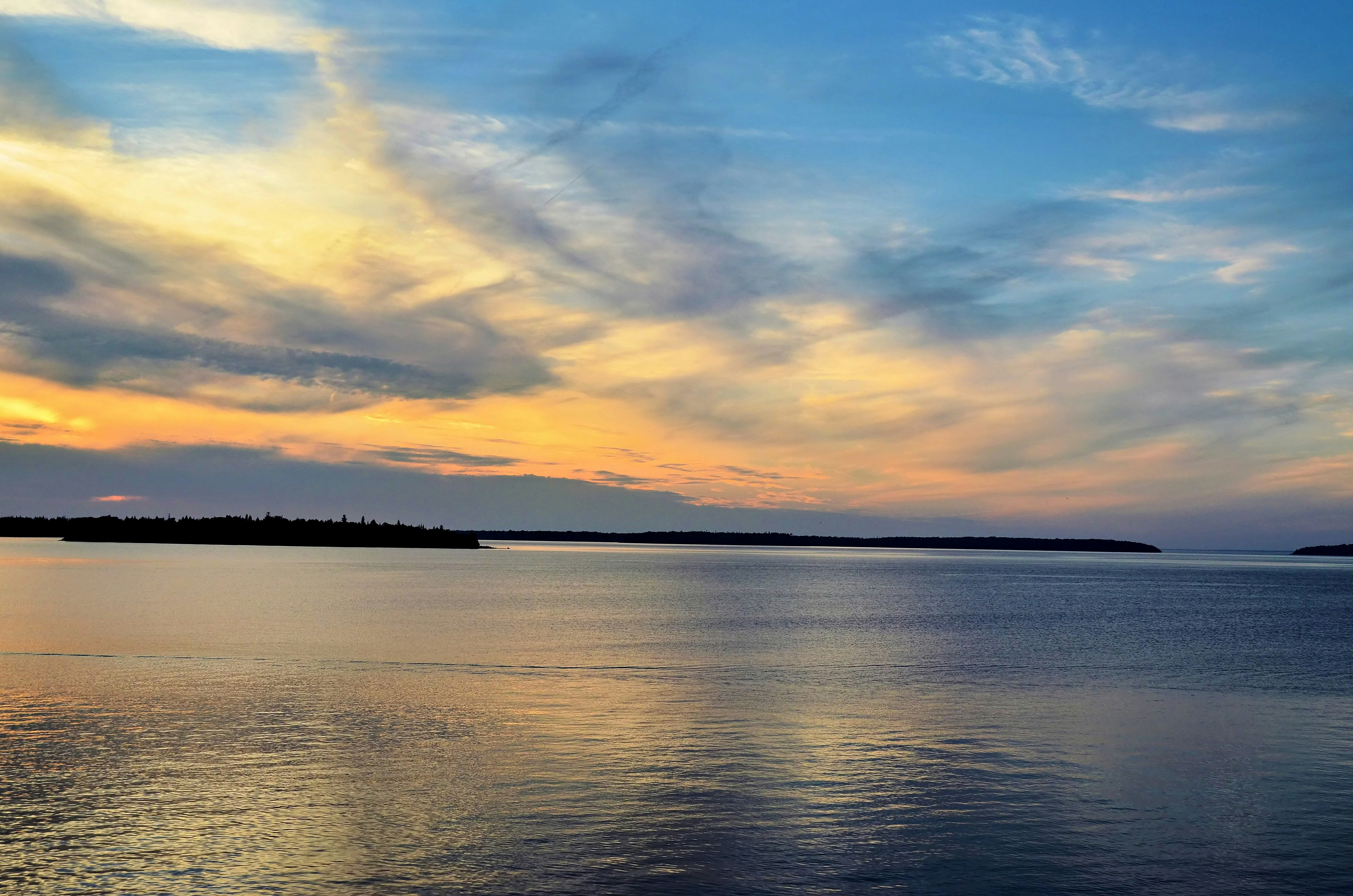 Dusk over Quiet Waters: Horizon Dream in Blue and Gold