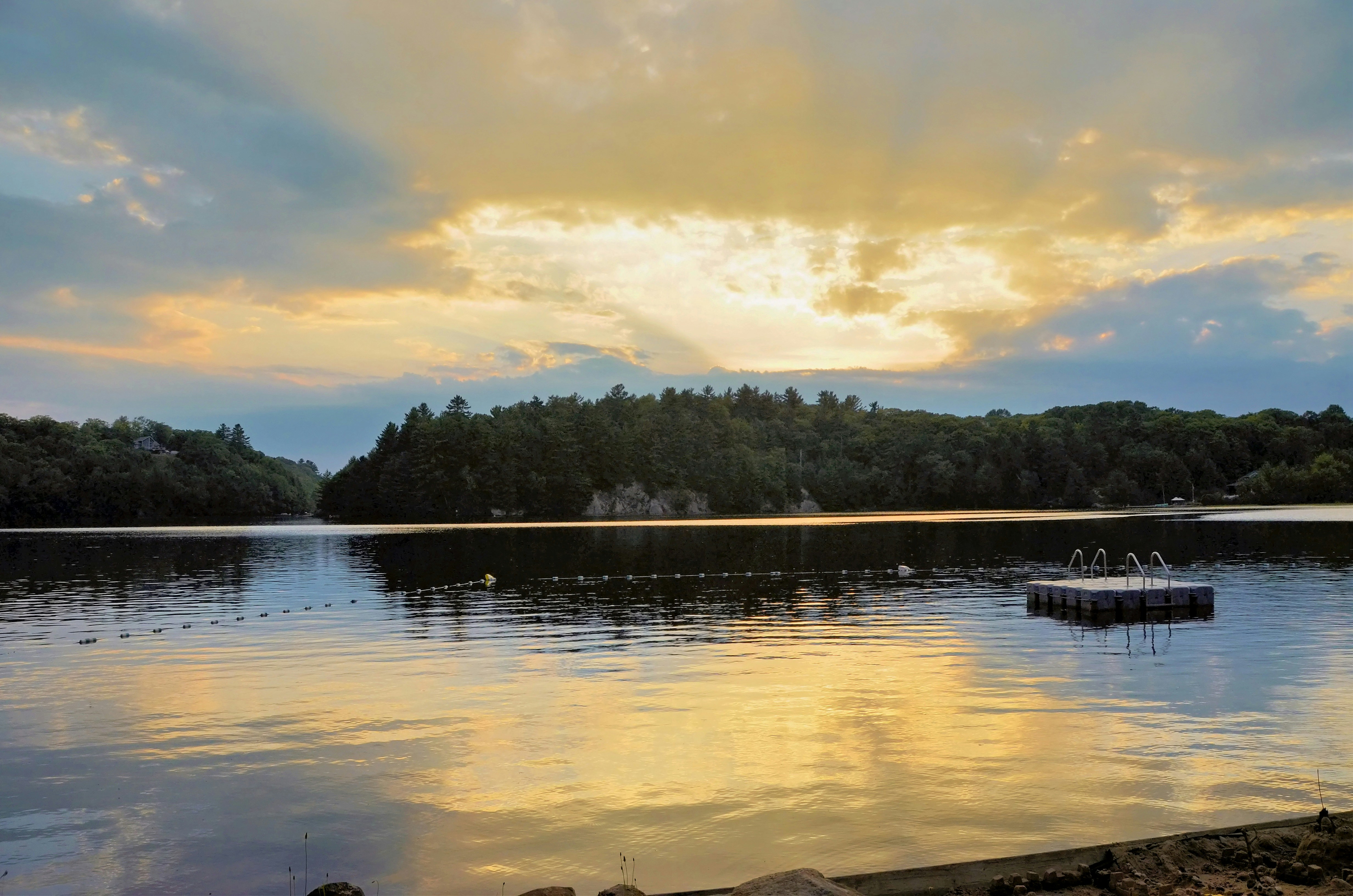 Golden Reflections Over a Quiet Lake