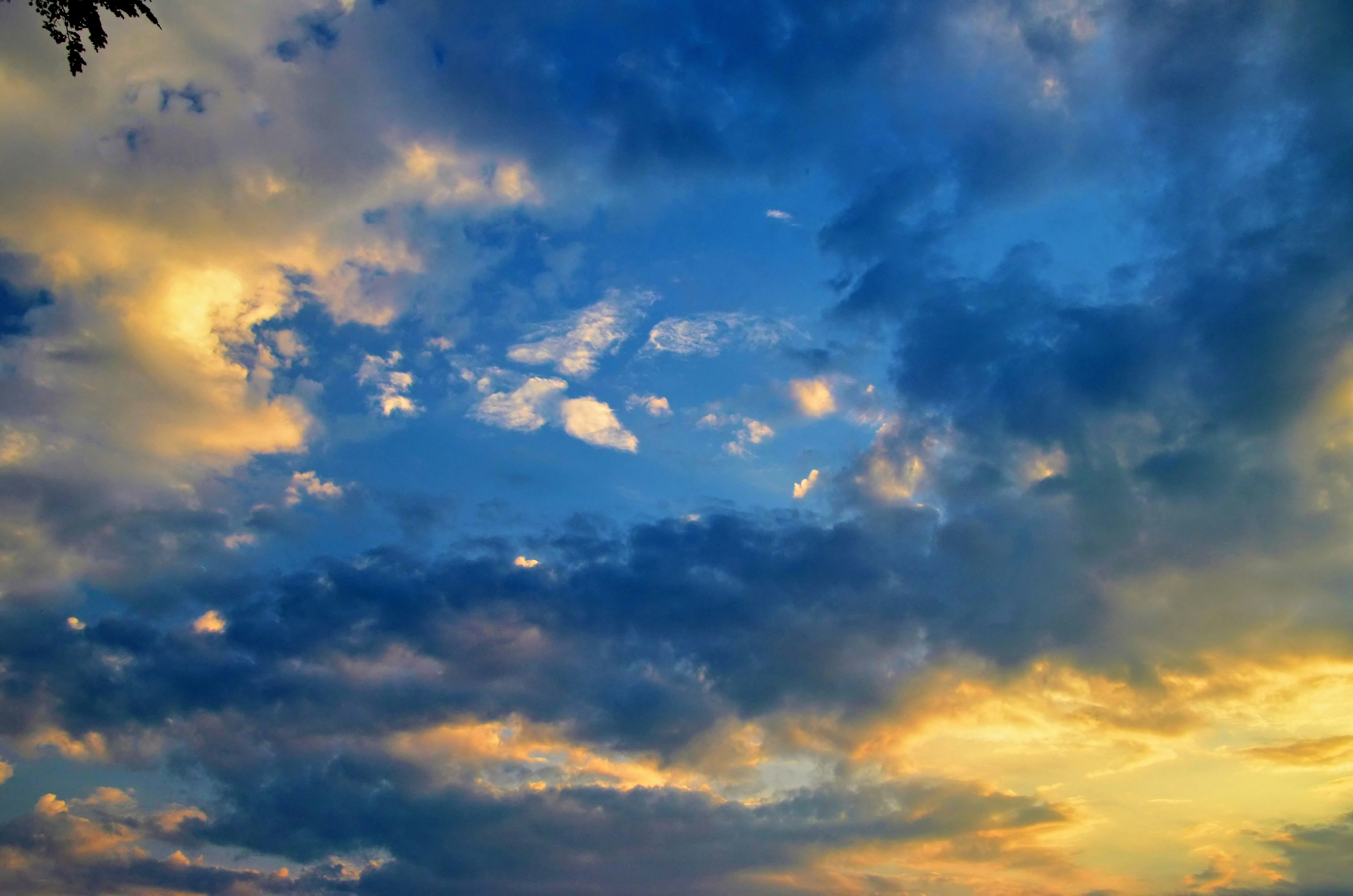 Golden Hour Skyburst Over Calm Horizon