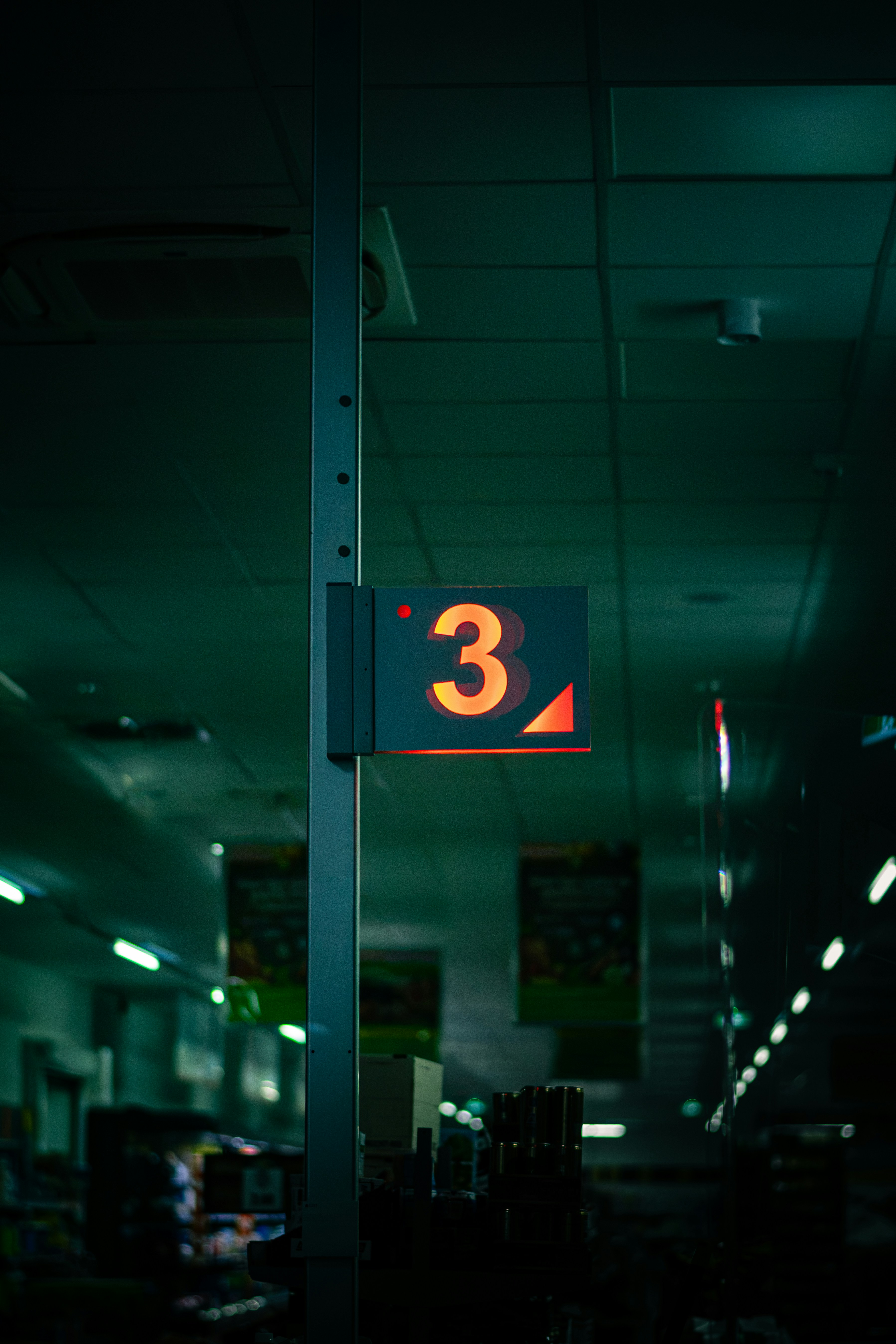 Neon Signage Over Aisle: The Quiet Pulse of Night Shoppers