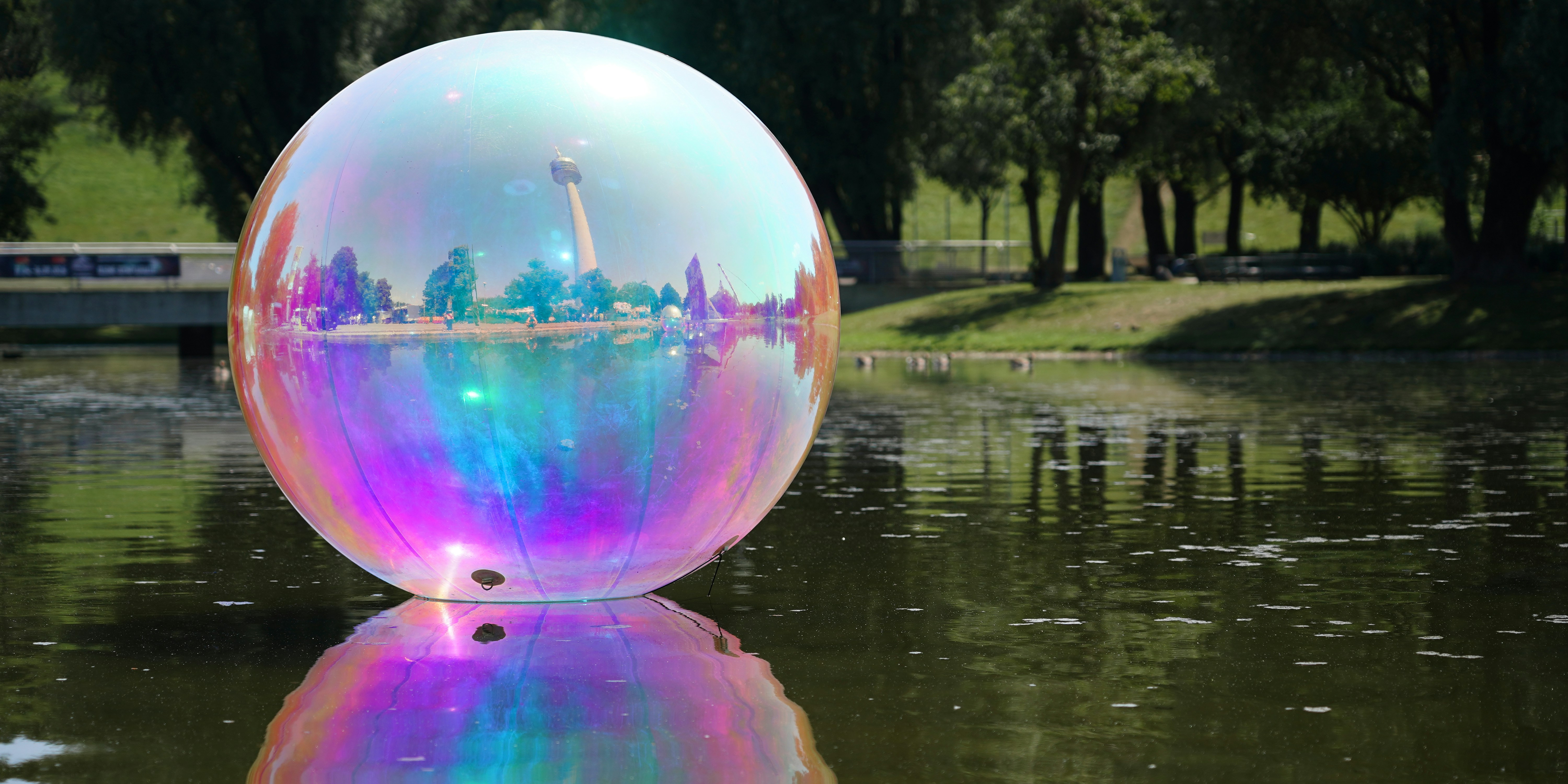 Iridescent Orbs on a Quiet Lake