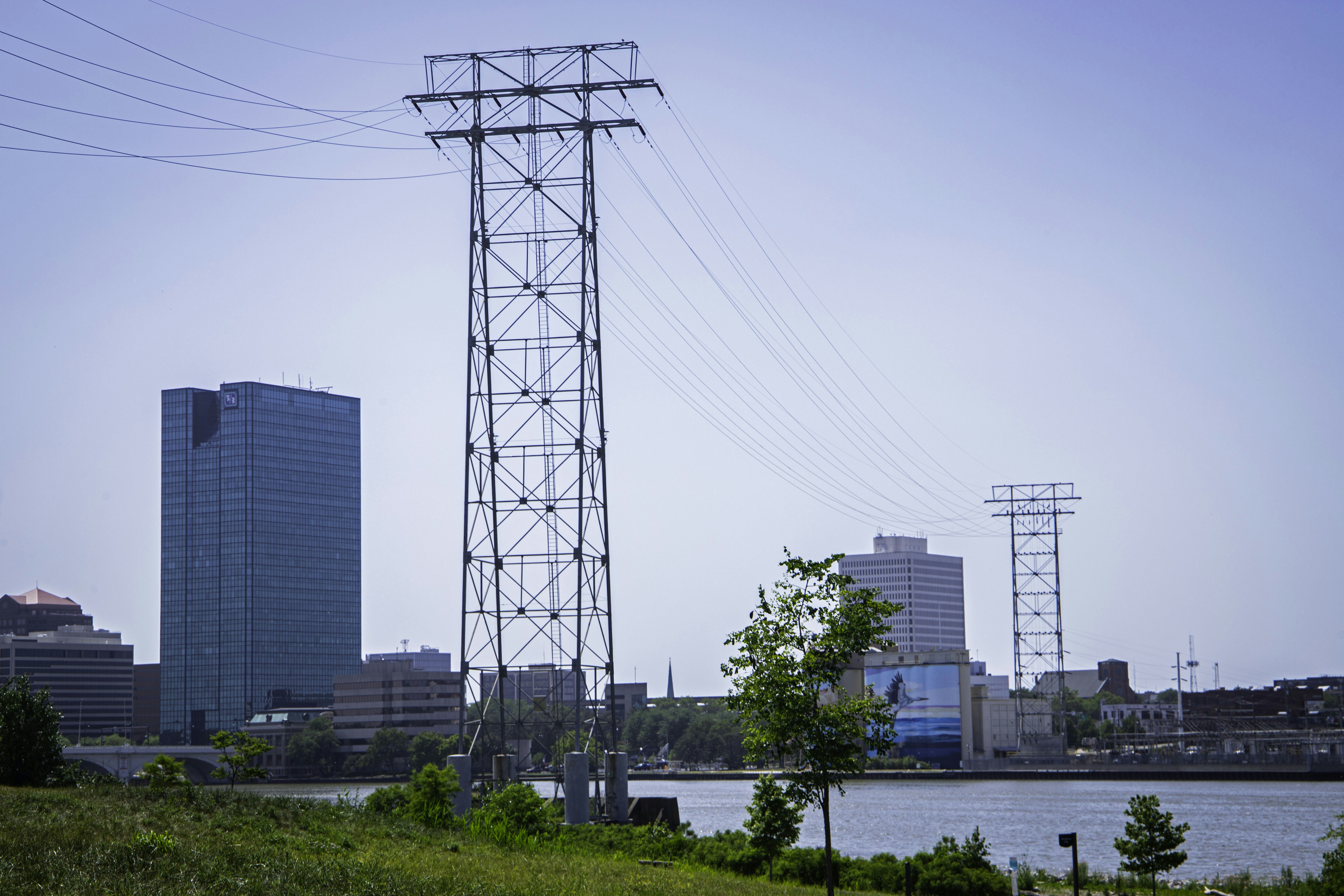 Urban Grid: Power Lines Crossing the Riverside