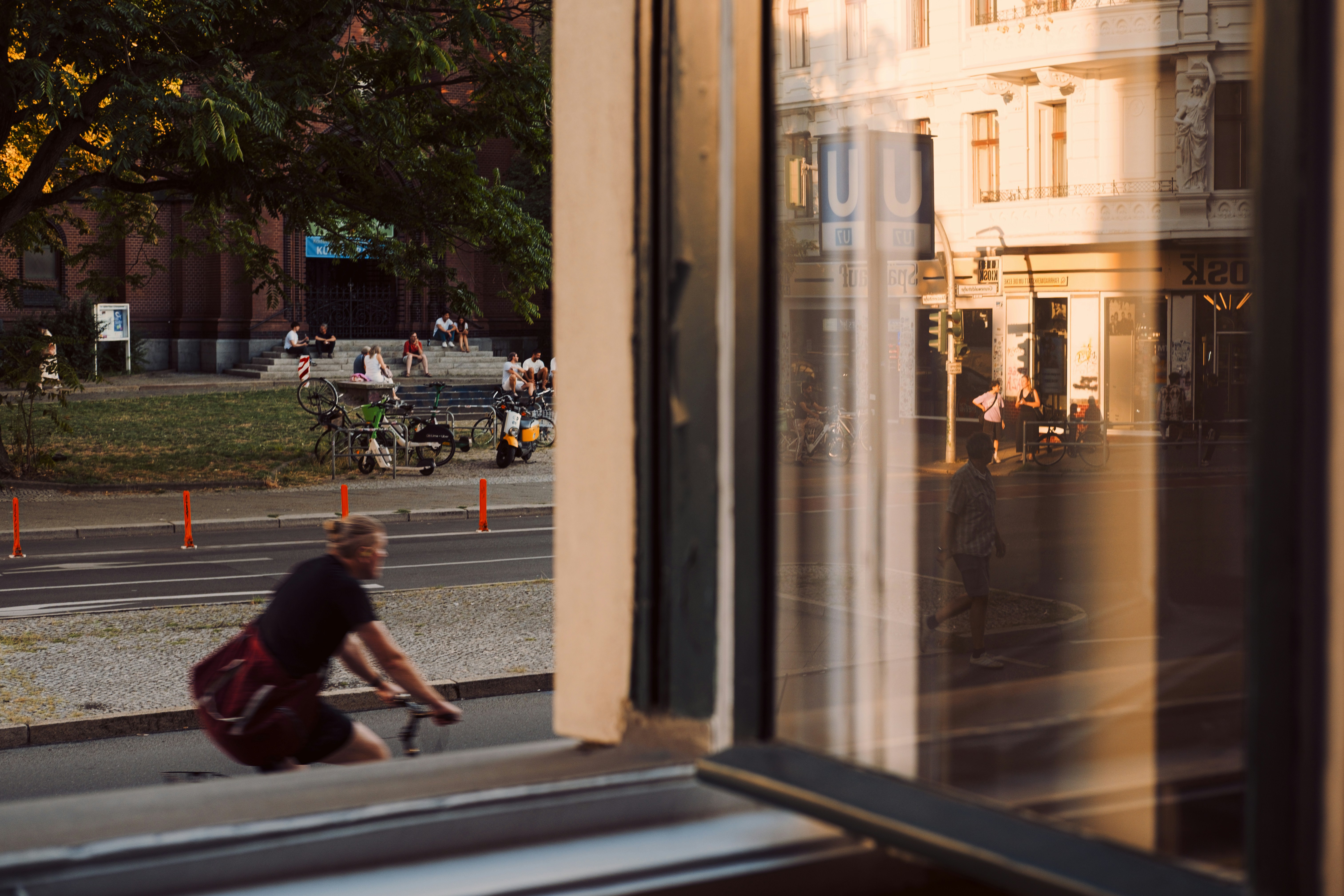 Reflections at the Window: A Quiet Urban Moment