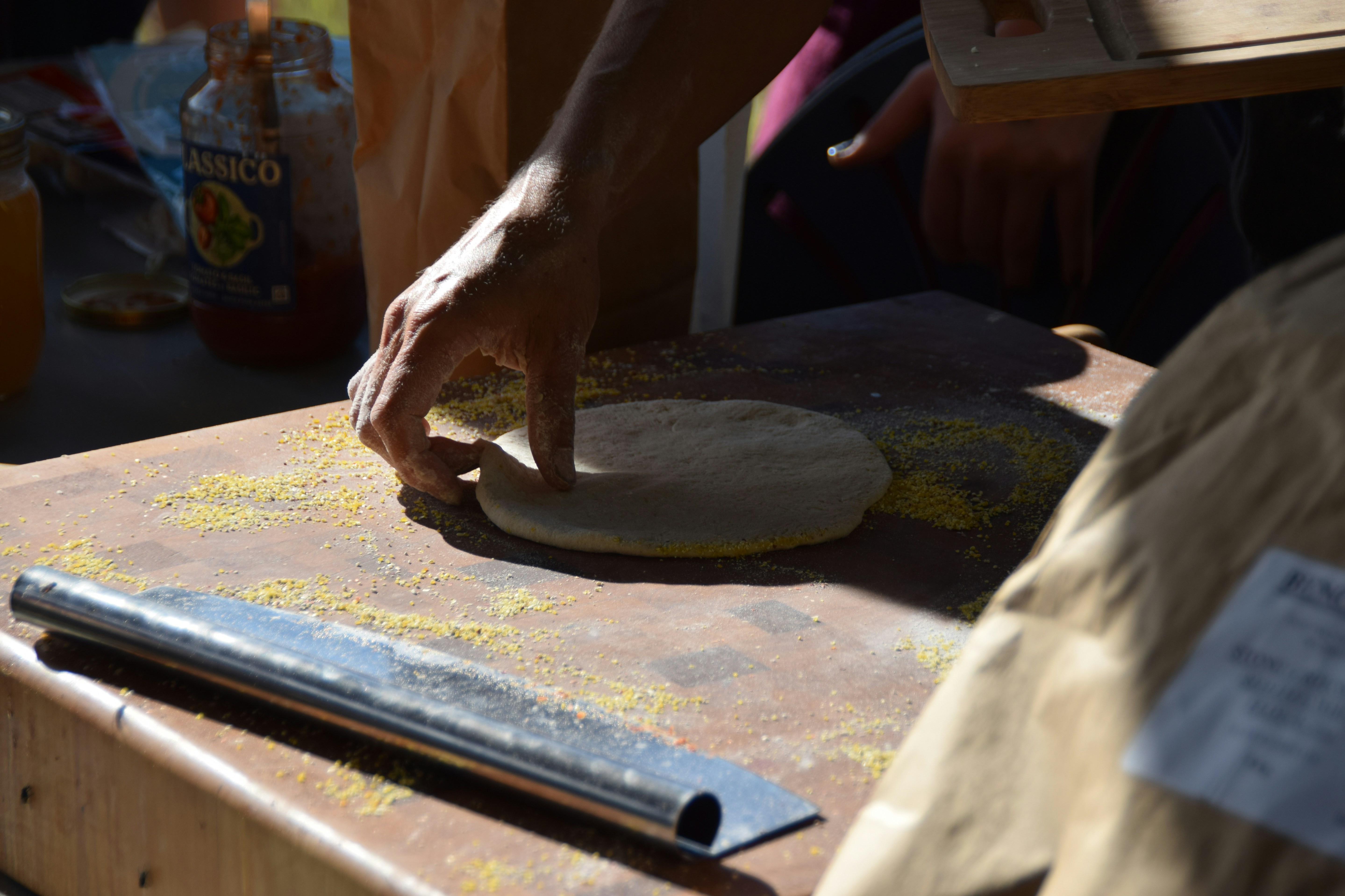 Handy Dough: Preparing Flatbread on a Sunlit Workbench