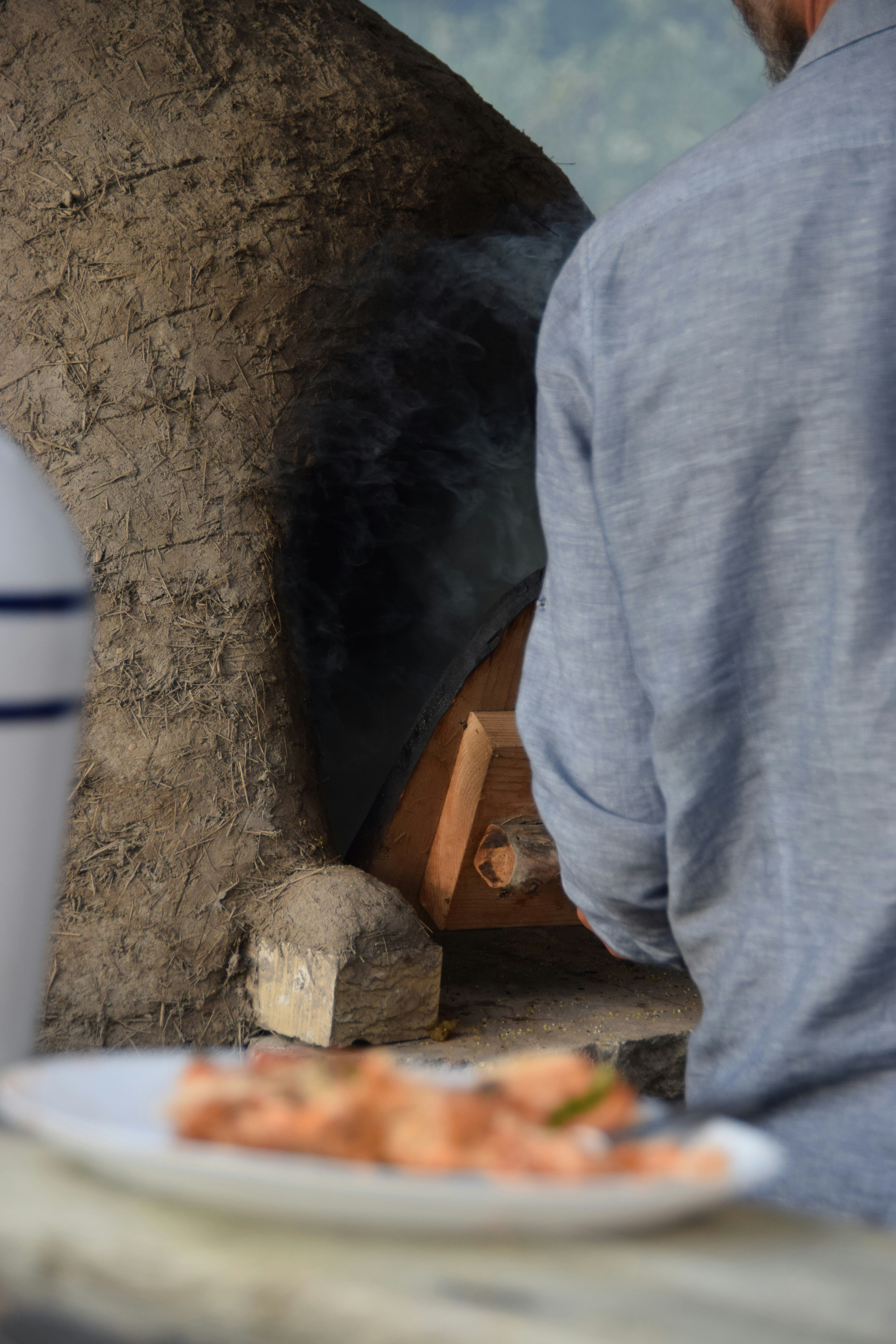 Grillside Portrait: A Quiet Moment Beside the Brick Oven